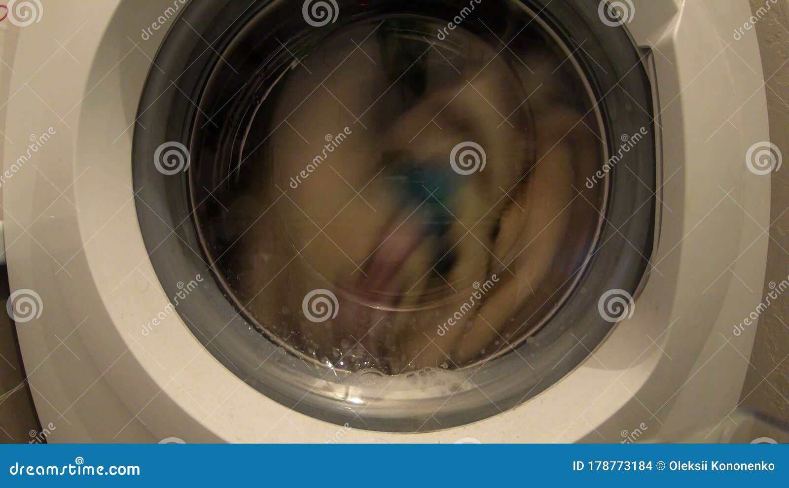 Clothes Spin in the Washing Machine. Washing Process. Timelapse. Stock ...
