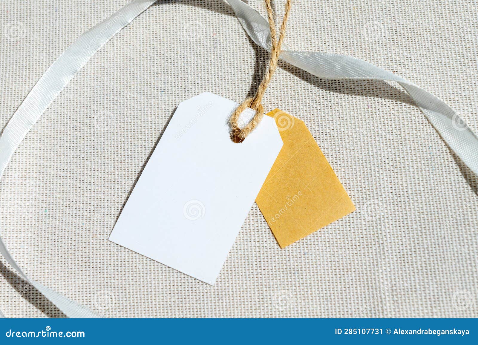 Two Rectangular Tags with a Rope on a Gray Fabric. Empty Label Mockup ...