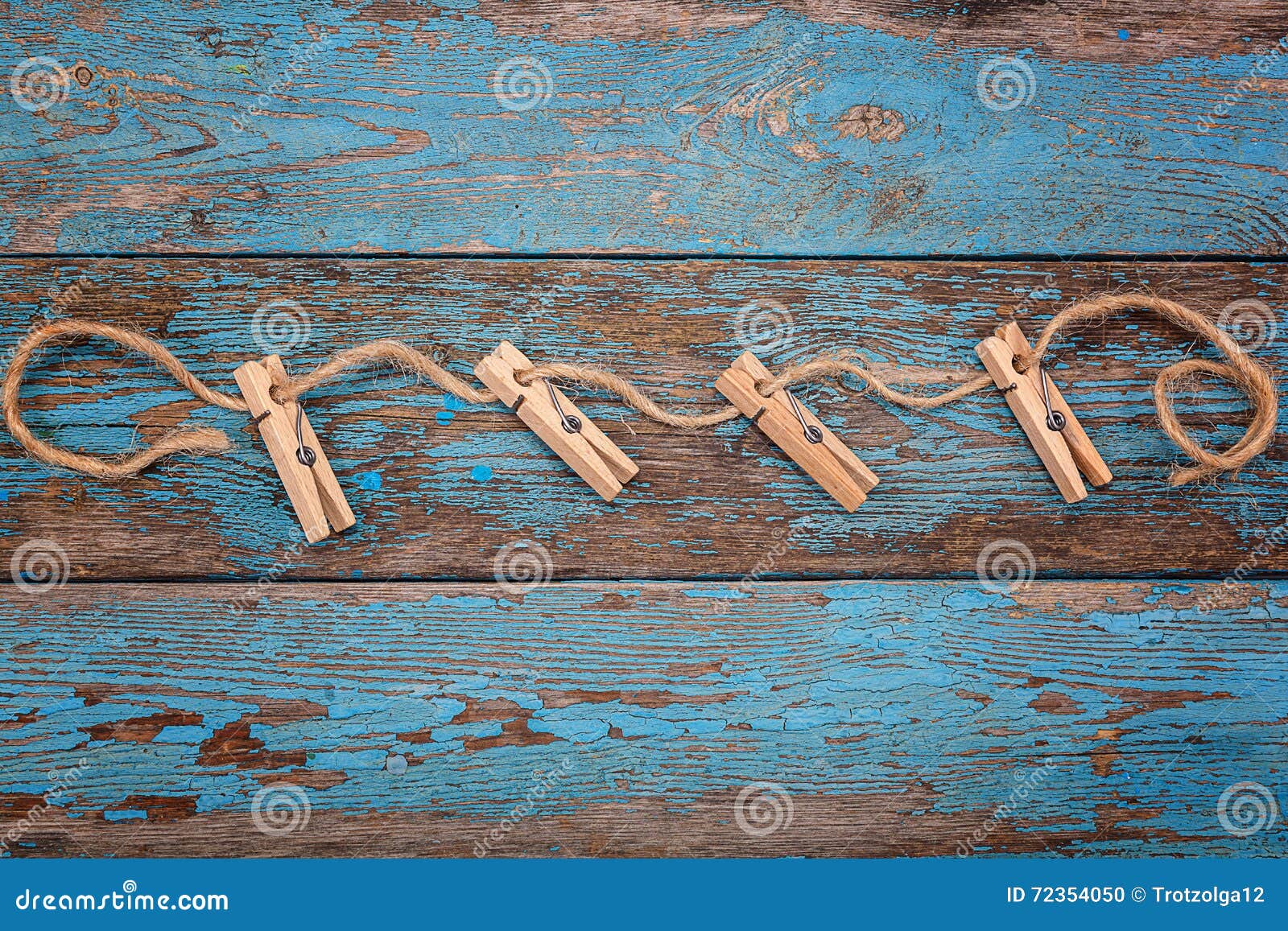 Clothespins with a Rope on Blue Wooden Boards Stock Photo - Image of ...