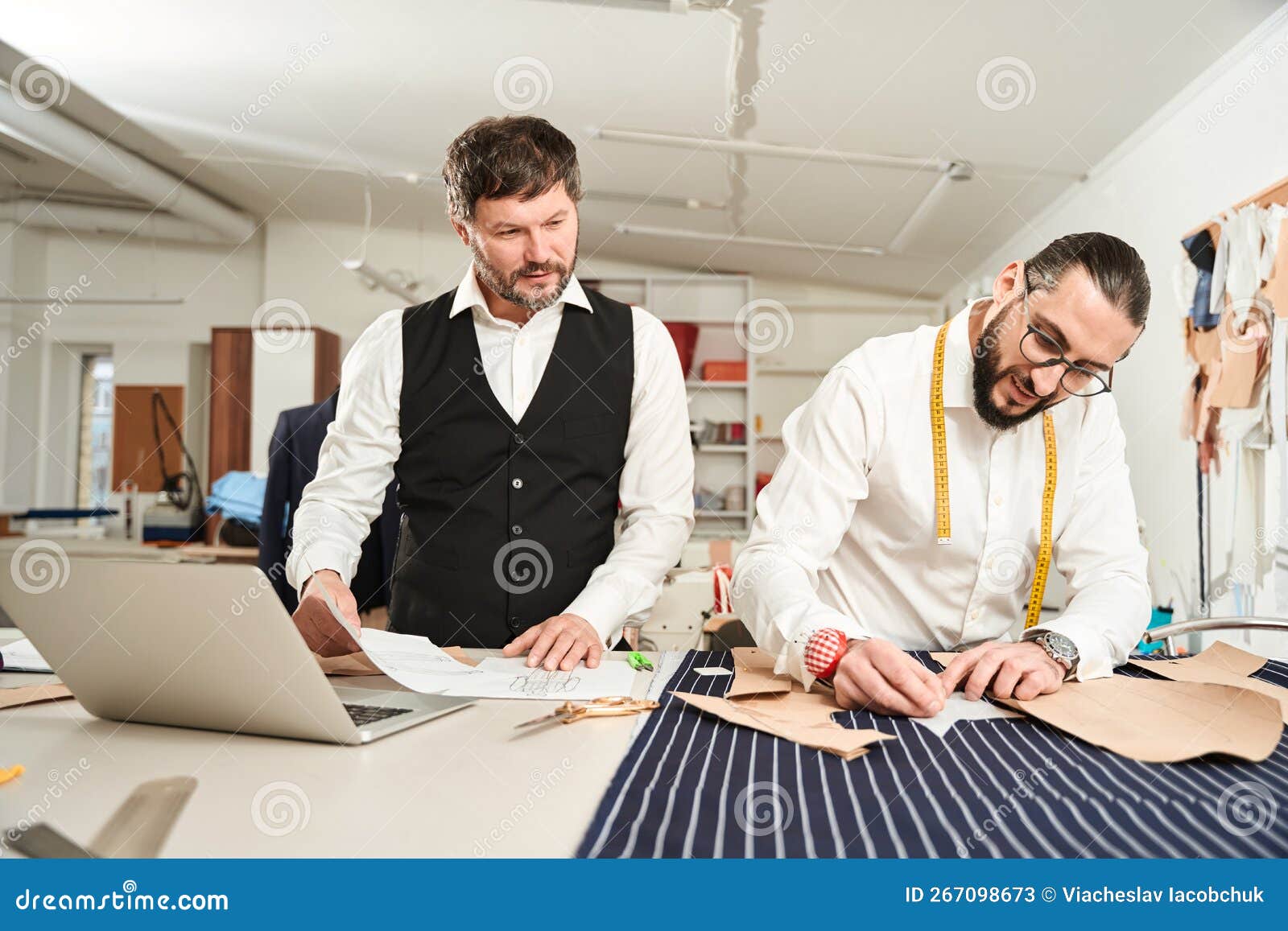 Clothier Working in Sewing Workshop Supervised by His Colleague Stock ...