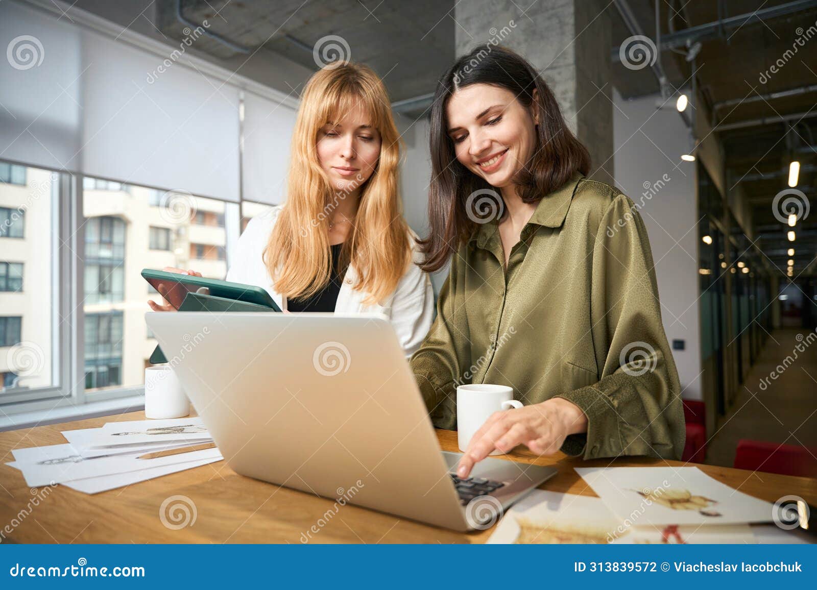 Clothing Designer and Assistant Working Together Using Technologies ...