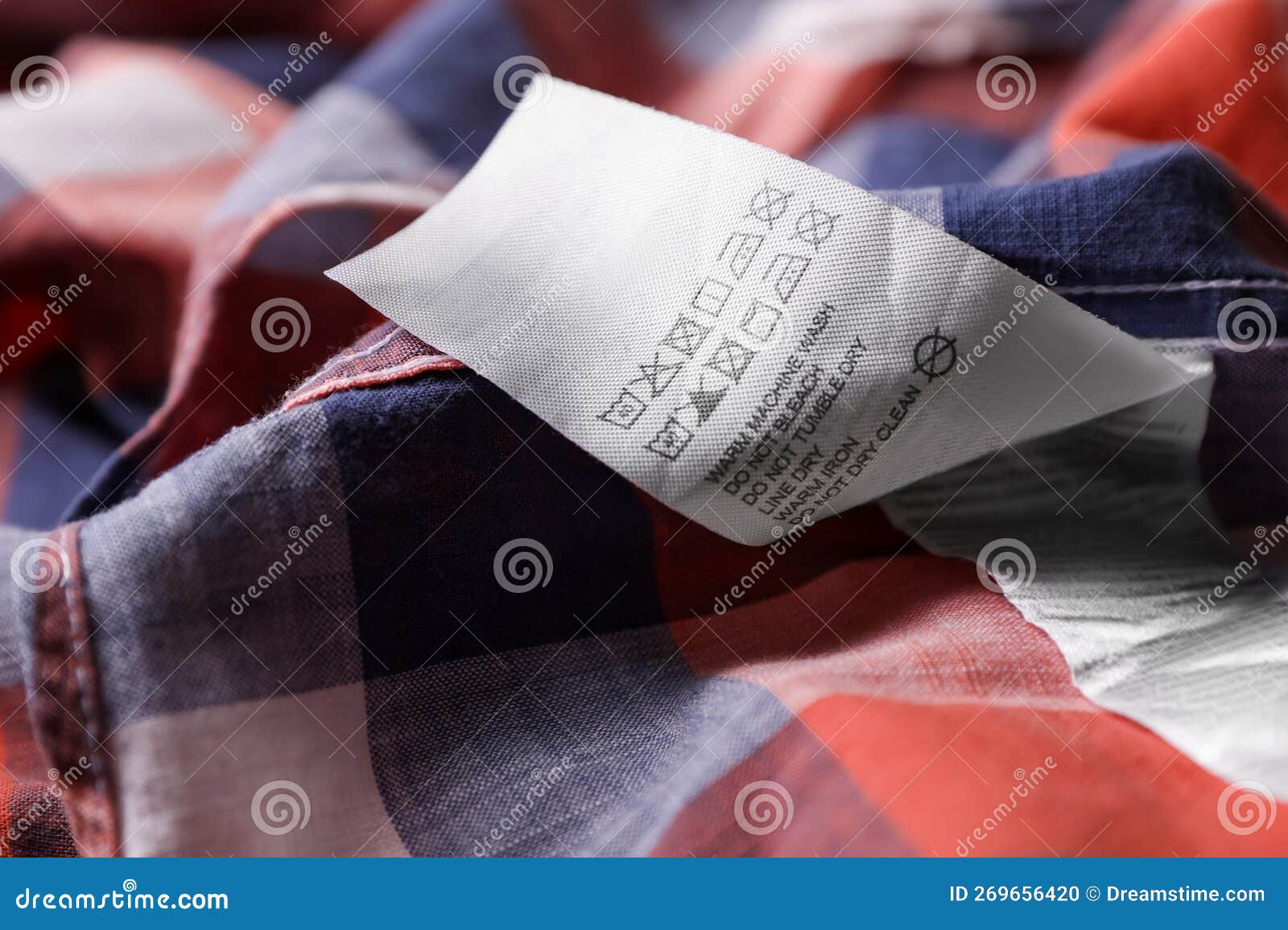 Clothing Label on Beautiful Checkered Garment, Closeup Stock Photo ...