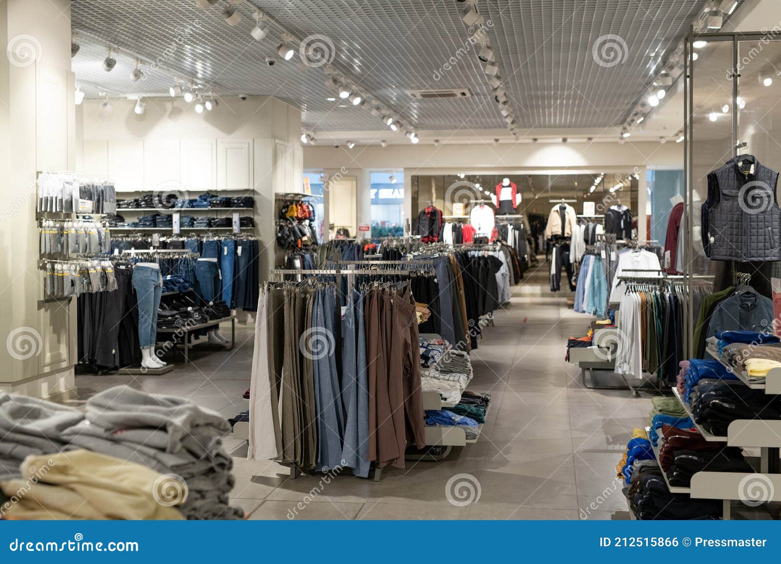 Clothing on Shelfs in Store Stock Photo - Image of design, suit: 212515866