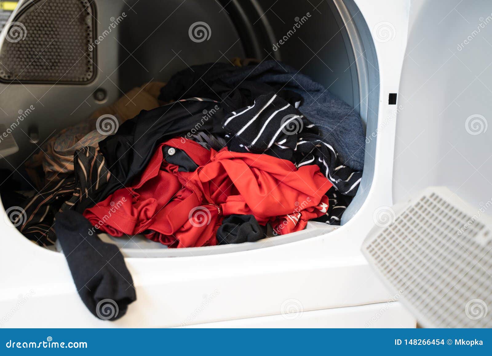 Clothing Sitting Inside of a Laundry Dryer, Ready To Be Folded Stock ...