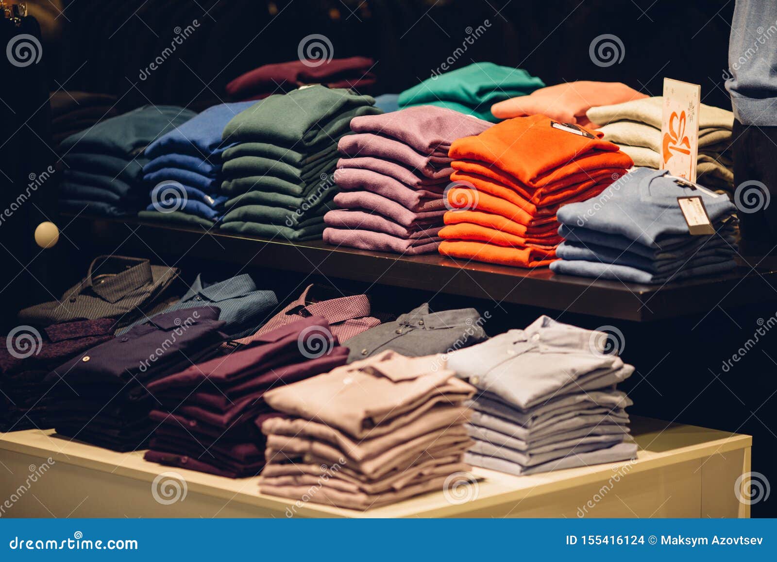 Stack of Folded Colorful Clothes in a Clothing Store Stock Photo ...