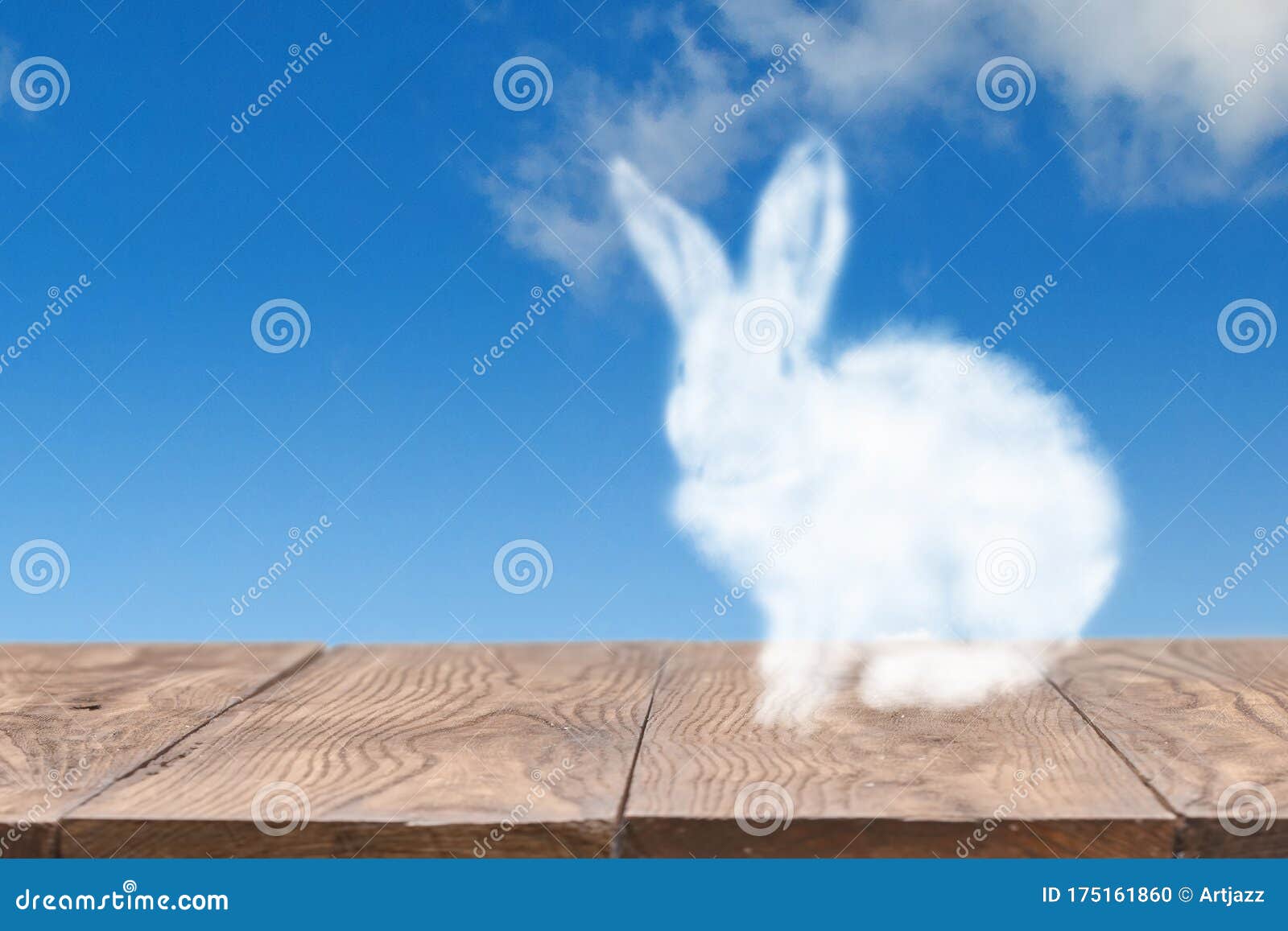 Cloud Easter Rabbit on a Wooden Table Against Blue Sky Background ...