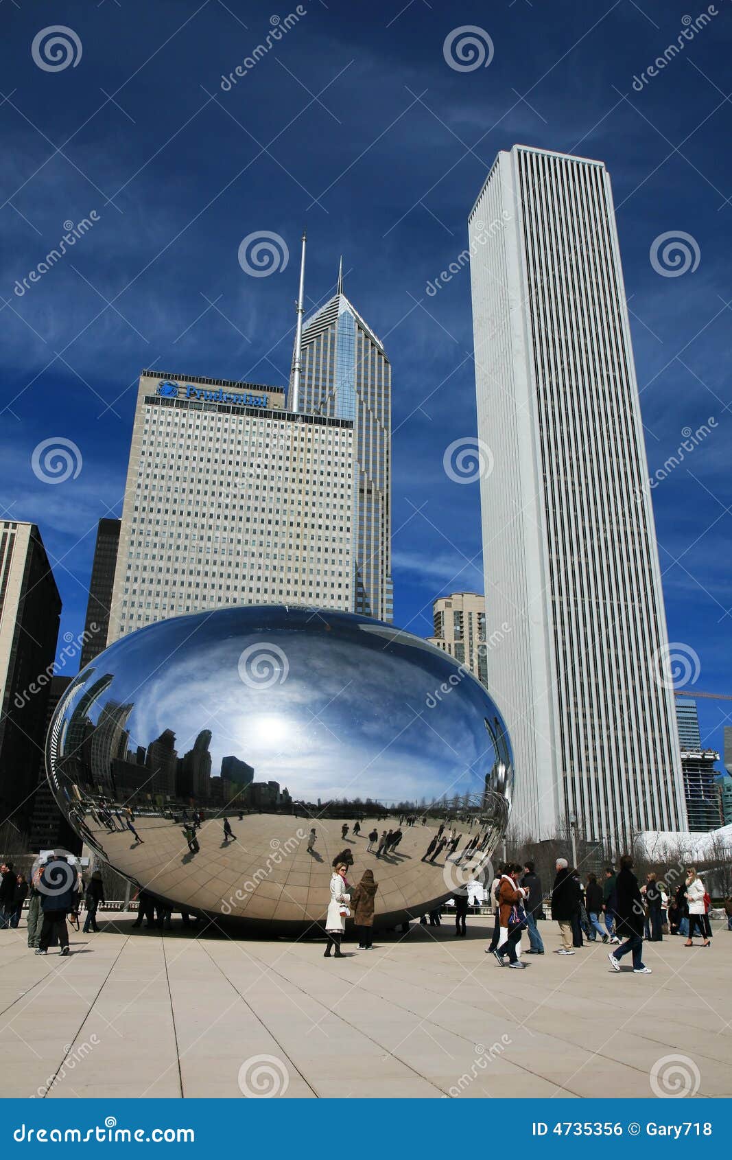 Cloud Gate Sculpture, AKA The Bean, Against Downtown Skyline In Chicago ...