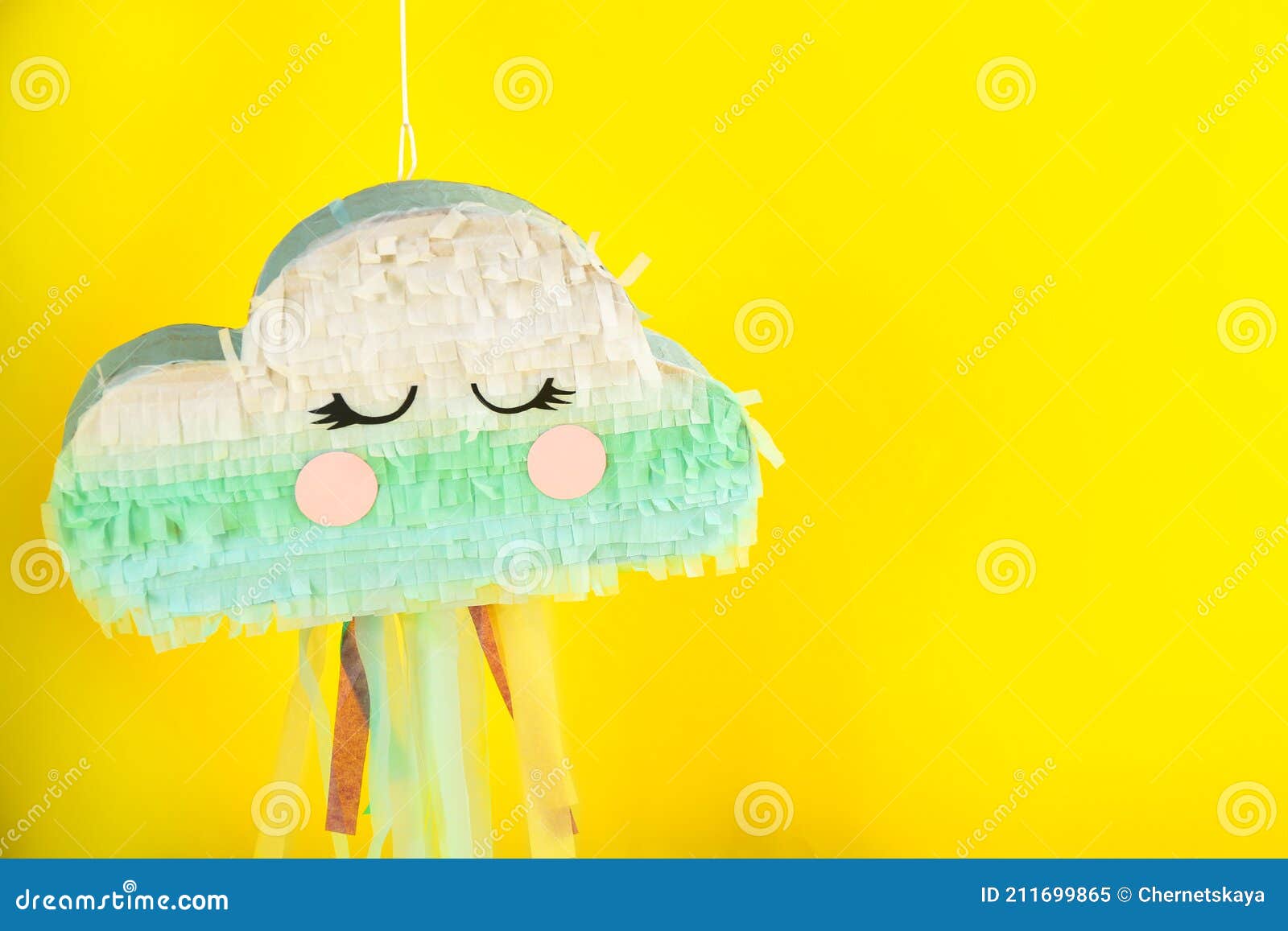 Cloud Shaped Pinata Hanging on Yellow Background. Space for Text Stock ...