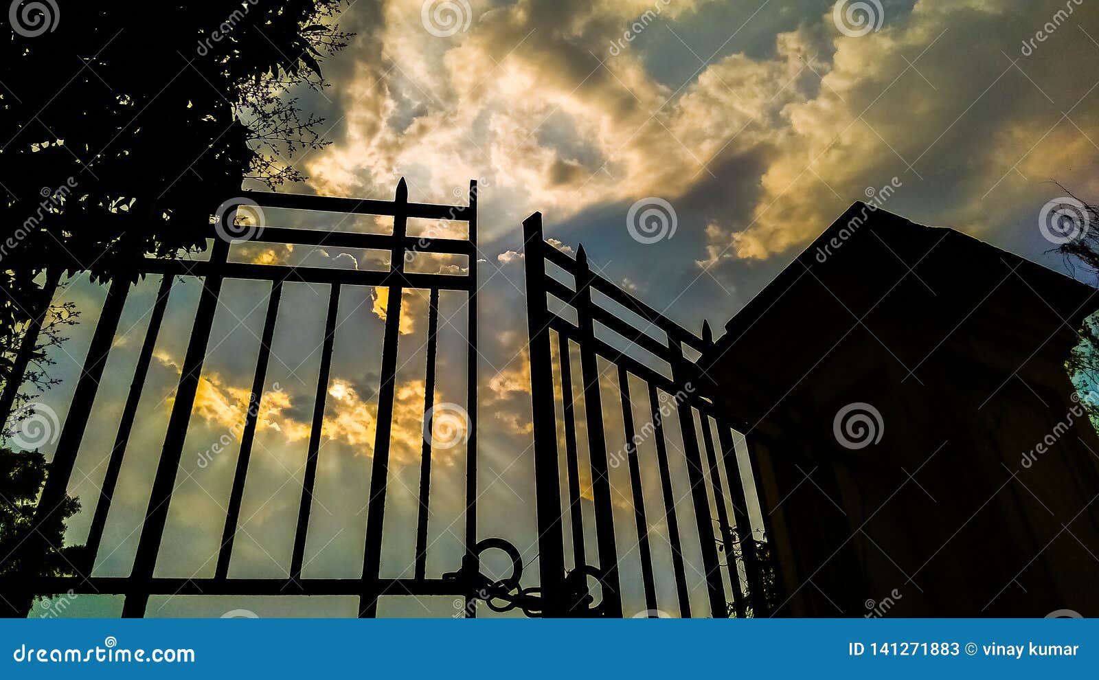 Clouded blue sky stock image. Image of gate, flowers - 141271883