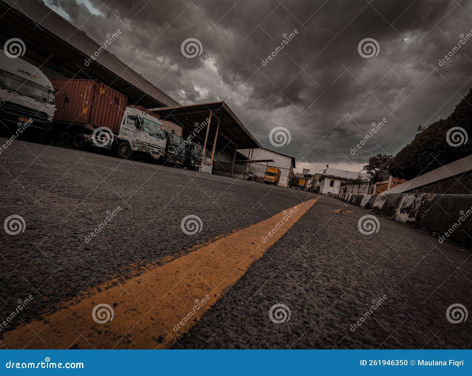 Cloudly warehouse truck editorial image. Image of storm - 261946350