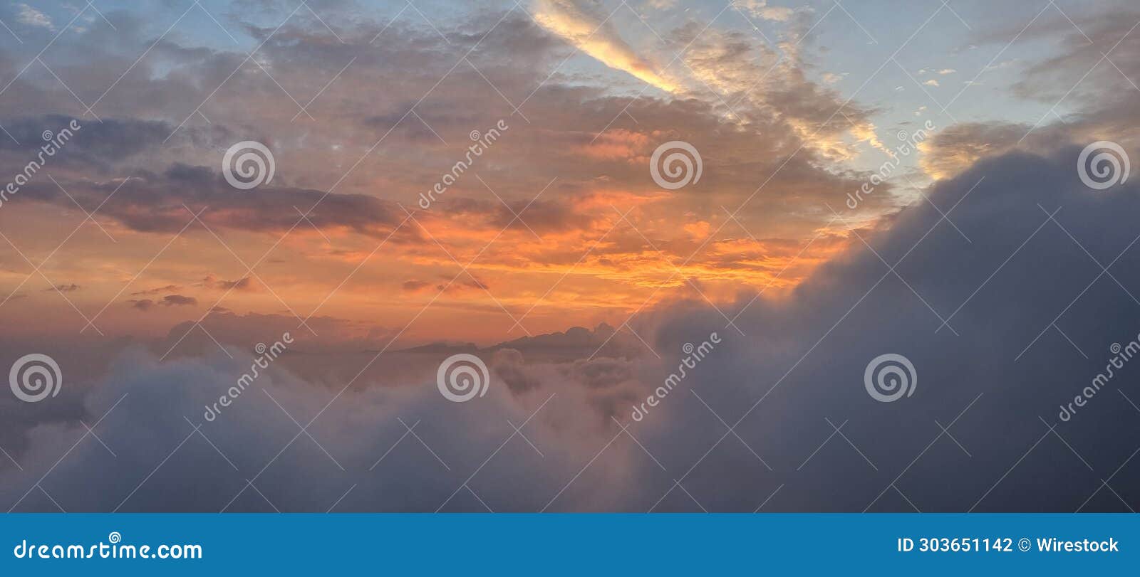 Clouds in the Air are High Up Above Them, with the Sun Setting Stock ...