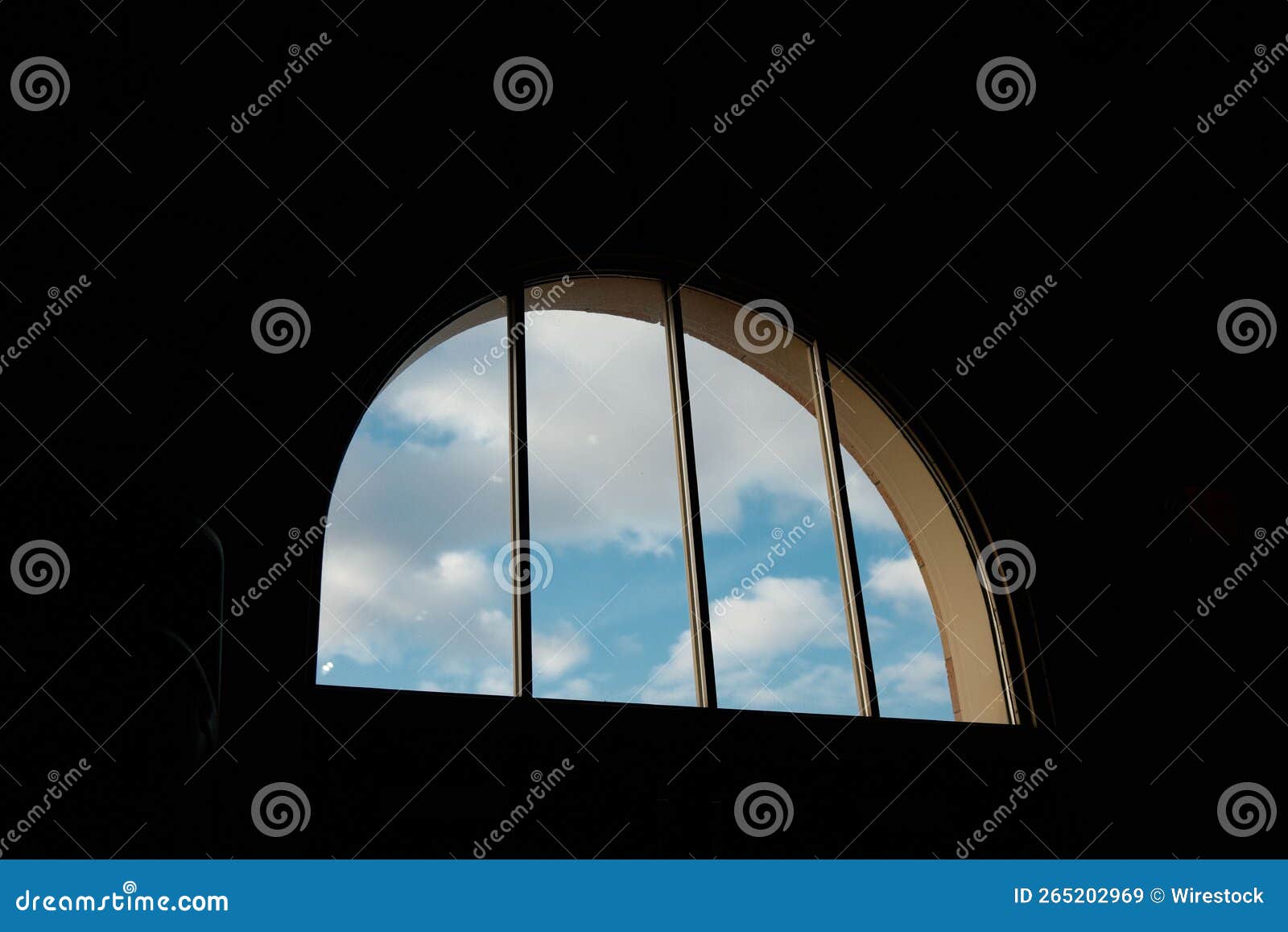Clouds in the Blue Sky Seen from a Semi-circular, Arched Window with ...