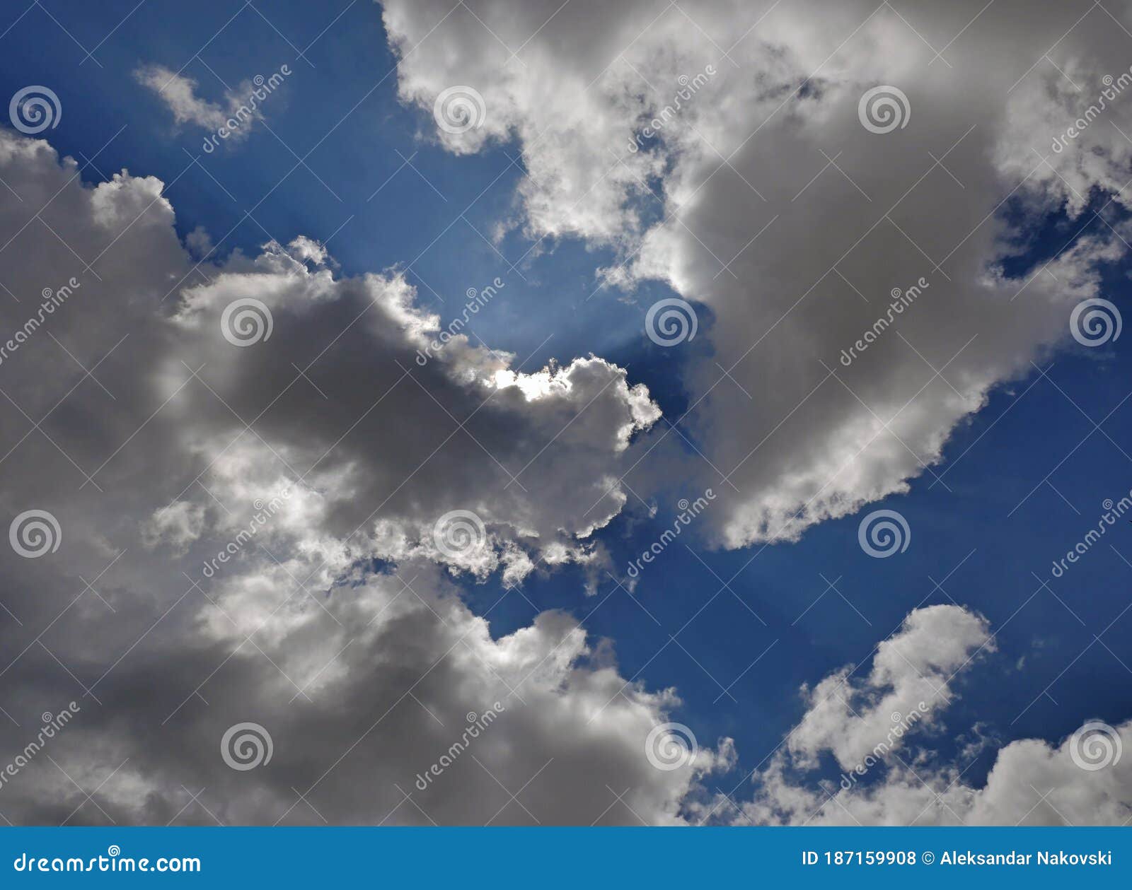 Clouds blue sky sun ray stock photo. Image of outdoors - 187159908