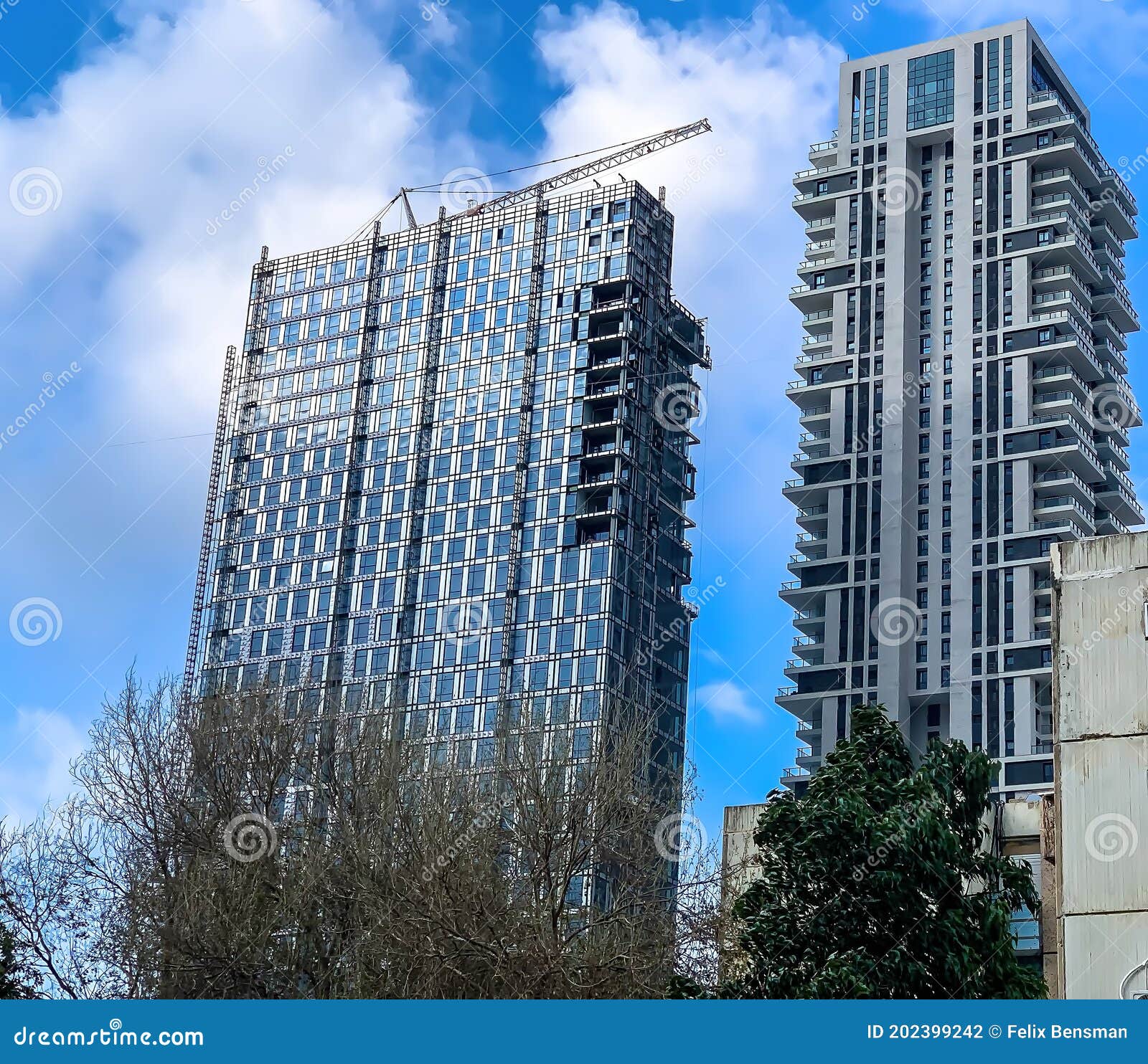 Clouds Float Over High-rise Buildings Stock Photo - Image of high, city ...