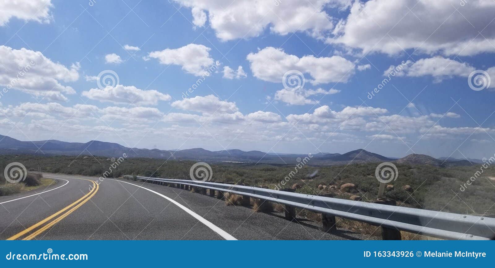 Clouds by the highway stock photo. Image of freeway - 163343926