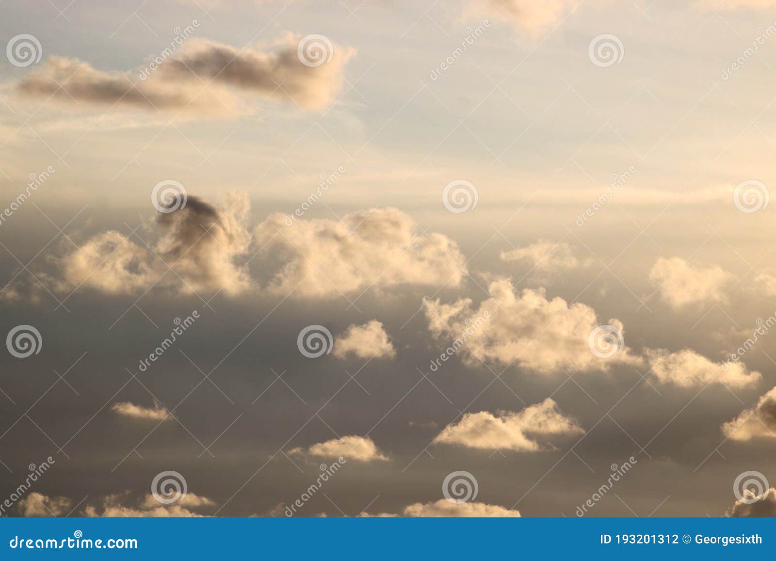 Clouds Lit by Evening Sun with Dark Clouds Behind Stock Photo - Image ...