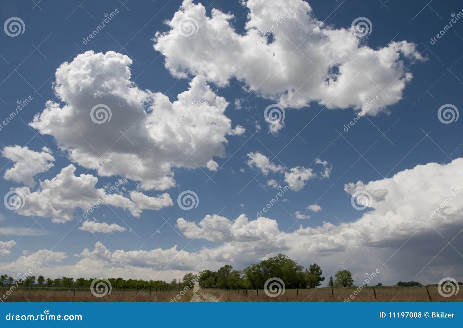 Clouds over country road stock photo. Image of rural - 11197008