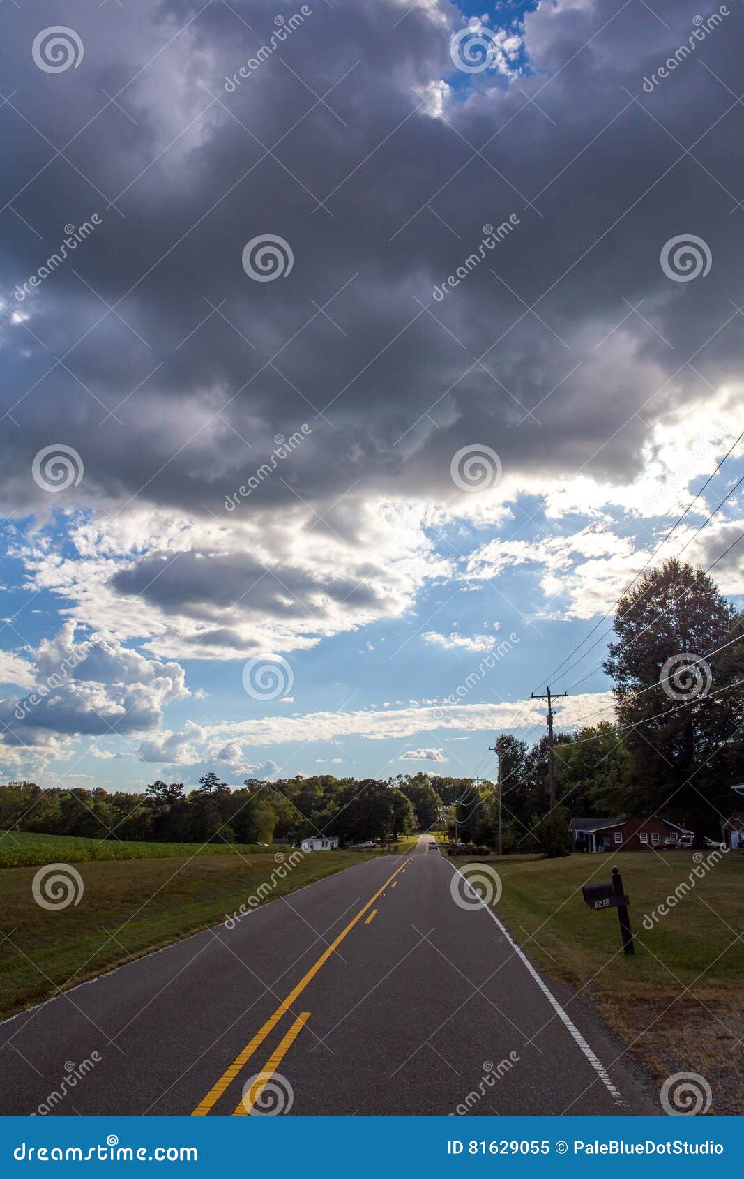 Clouds over a country road stock image. Image of mailbox - 81629055