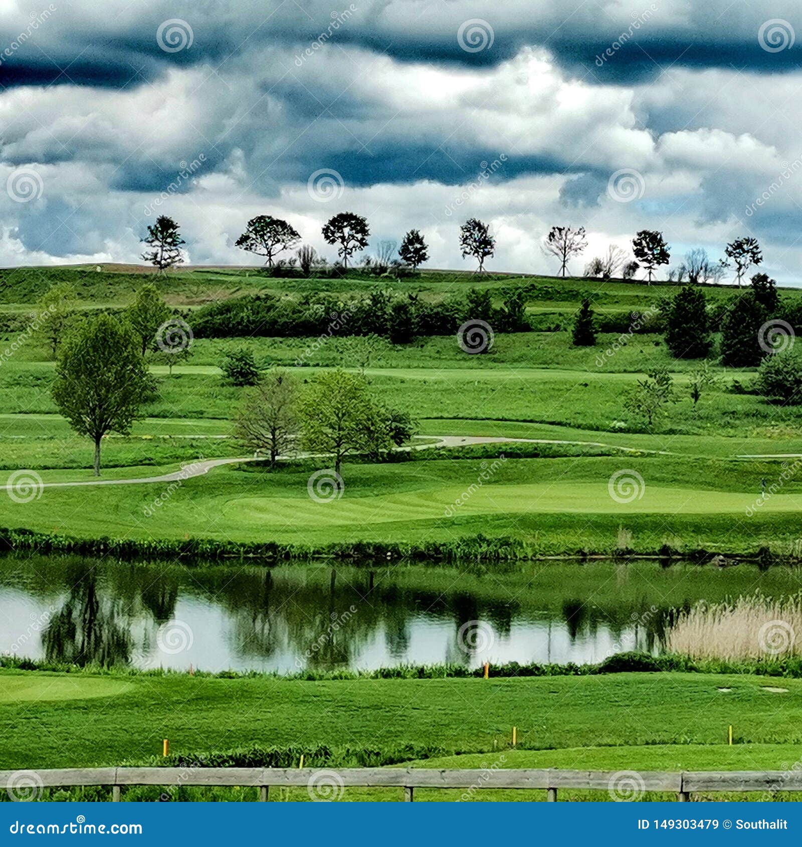 Clouds over a golf course stock image. Image of green - 149303479
