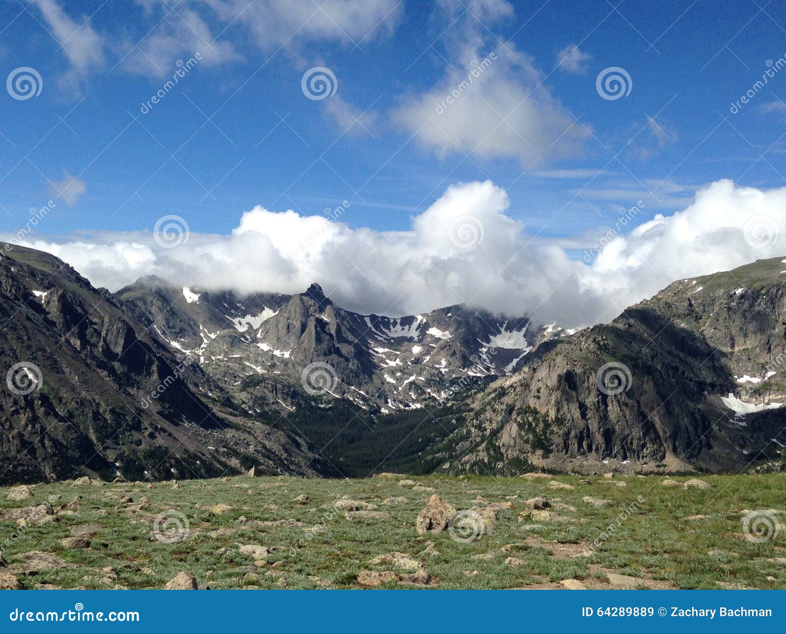 Clouds over Mountains stock image. Image of field, rocky - 64289889