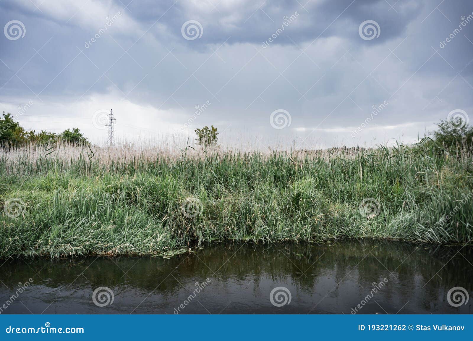 Clouds Over the River, the Grassy Bank of the River, Stock Photo ...
