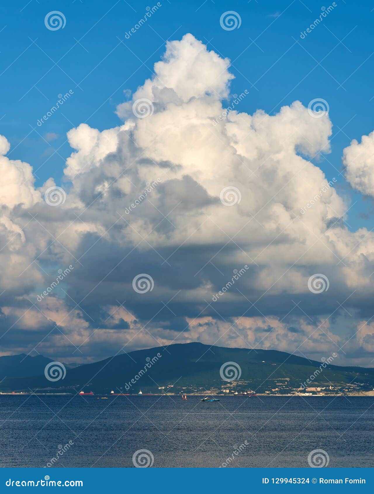 Clouds over the sea stock photo. Image of abstract, dusk - 129945324