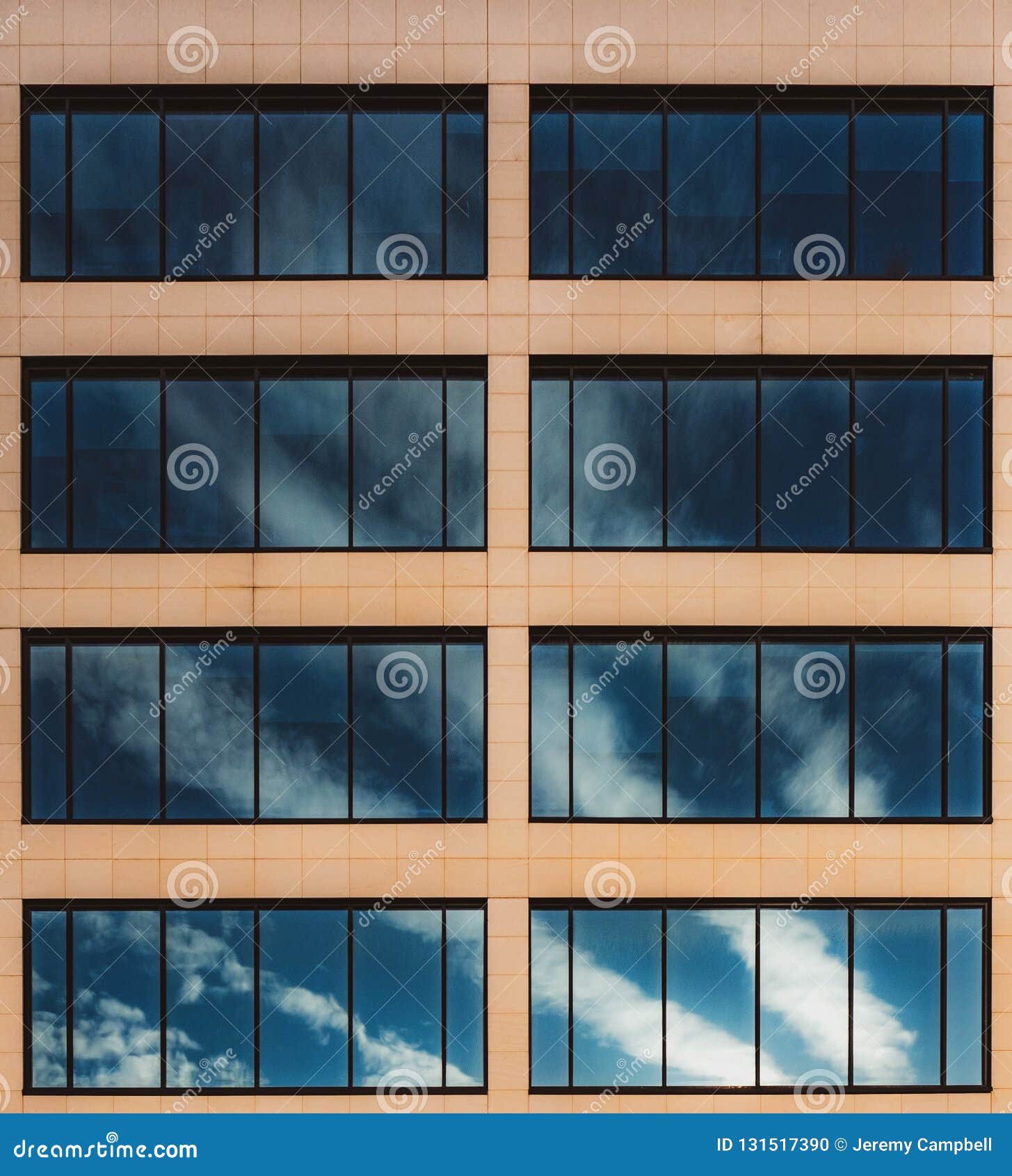 Clouds Reflected in Windows of an Office Building Stock Photo - Image ...