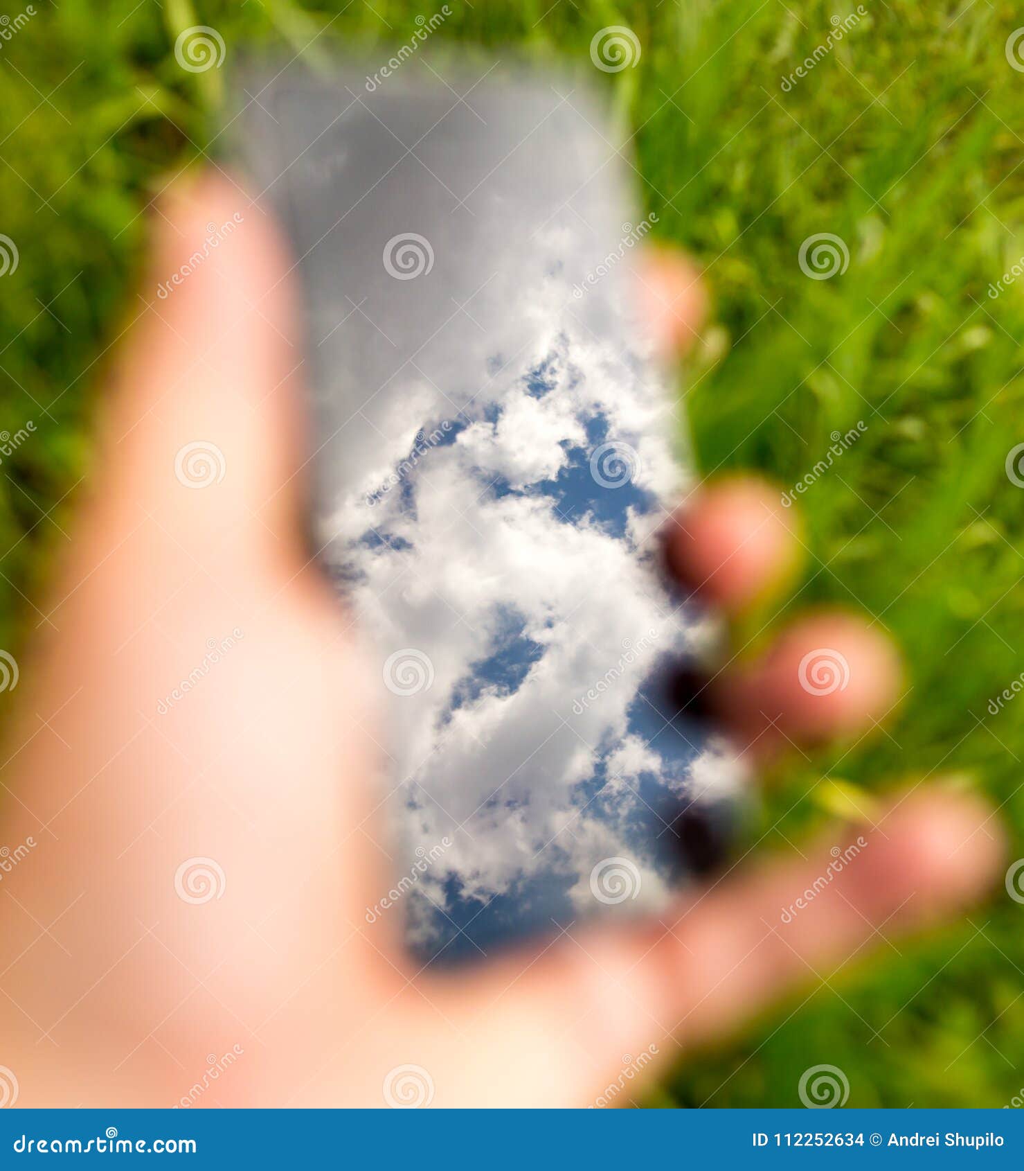 Clouds in Reflection of a Cell Phone in Hand Stock Photo - Image of ...