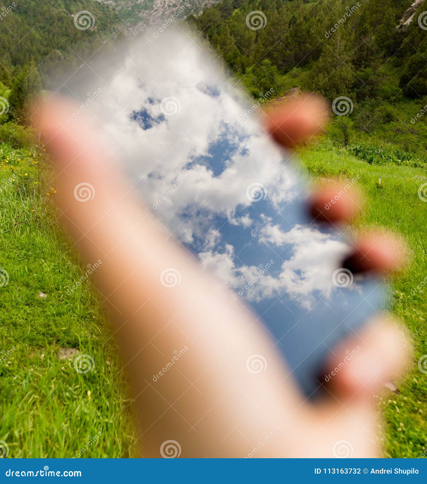 Clouds in Reflection of a Cell Phone in Hand Stock Photo - Image of ...