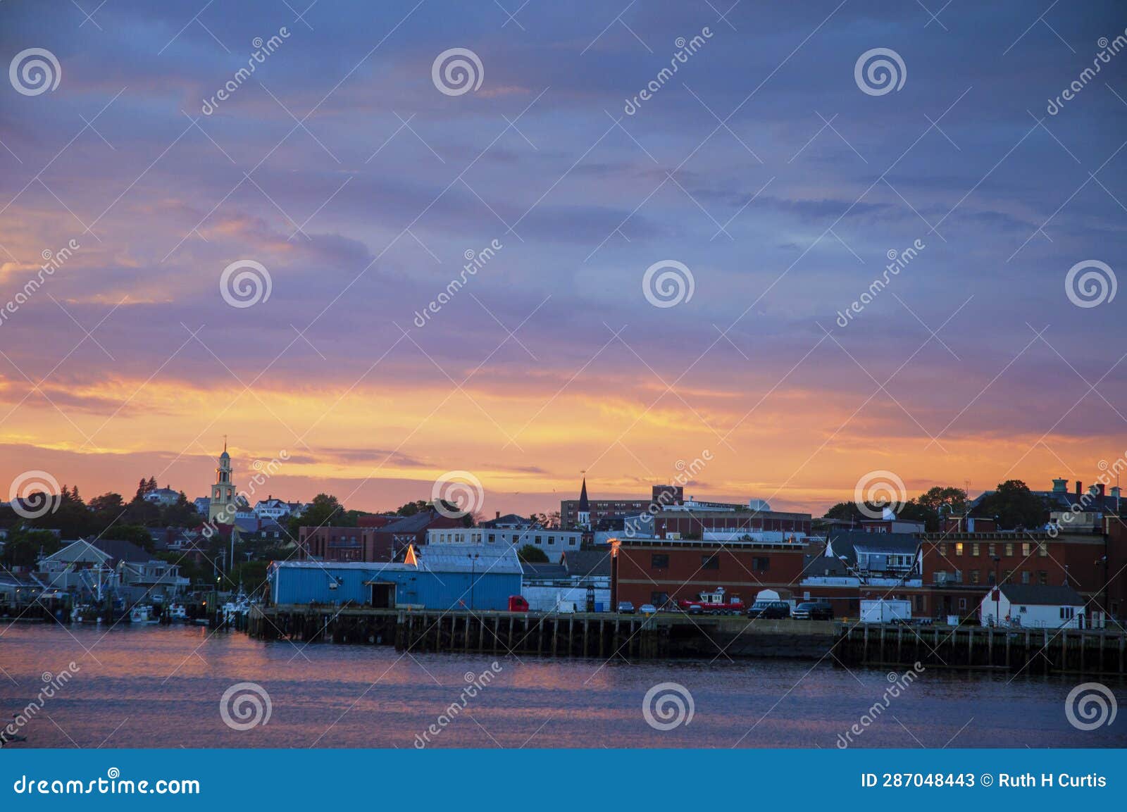 Sunsetting Along the Skyline of Gloucester, MA Stock Image - Image of ...