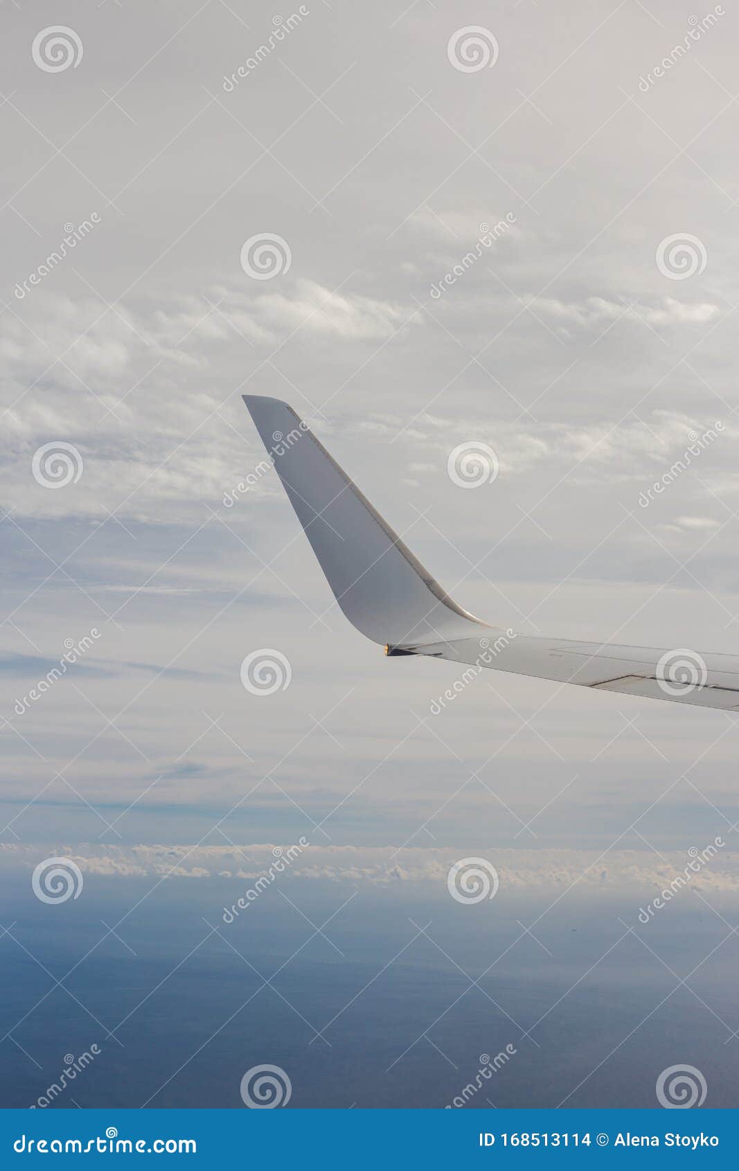 Clouds in the Sky Behind the Wing of an Airplane Stock Photo - Image of ...