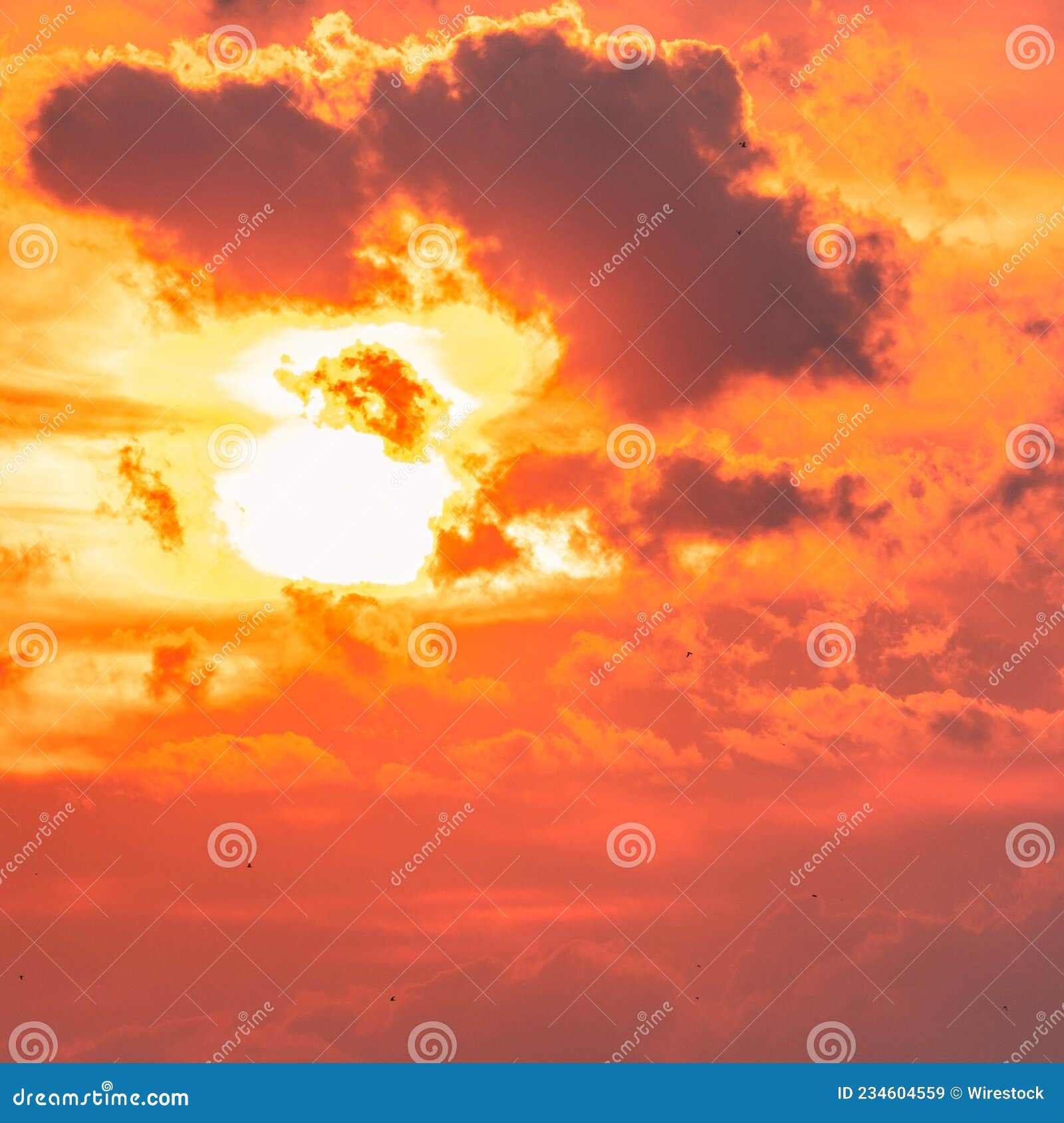 Clouds in the Sky with the Orange Sunlight Coming through Them at the ...