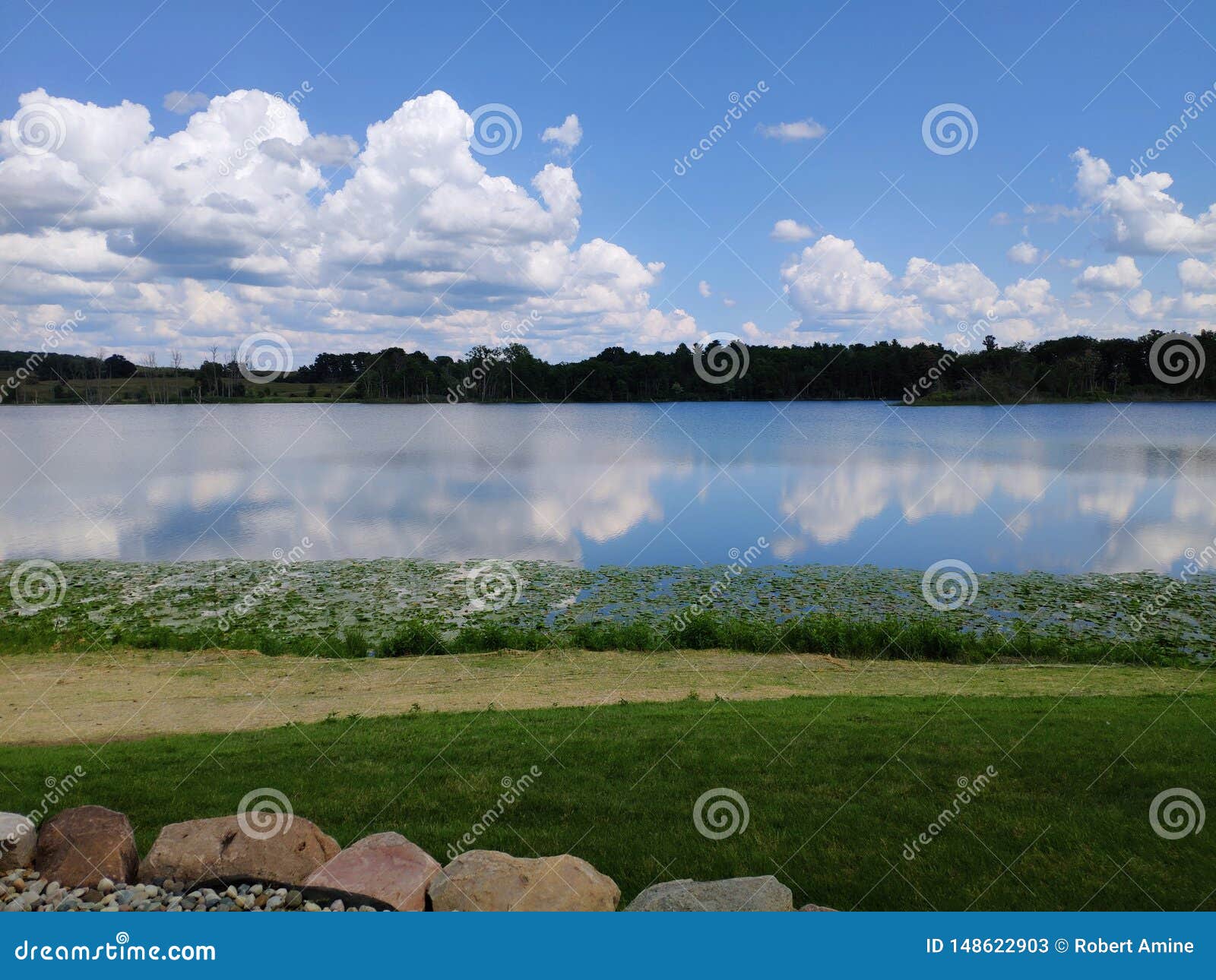 Clouds and Sky Reflect on Lake Stock Image - Image of clouds, blue ...