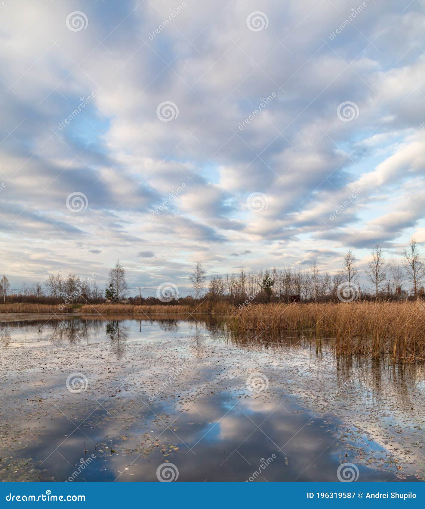 Clouds in the Sky with Reflection in the Lake at Sunset Stock Image ...