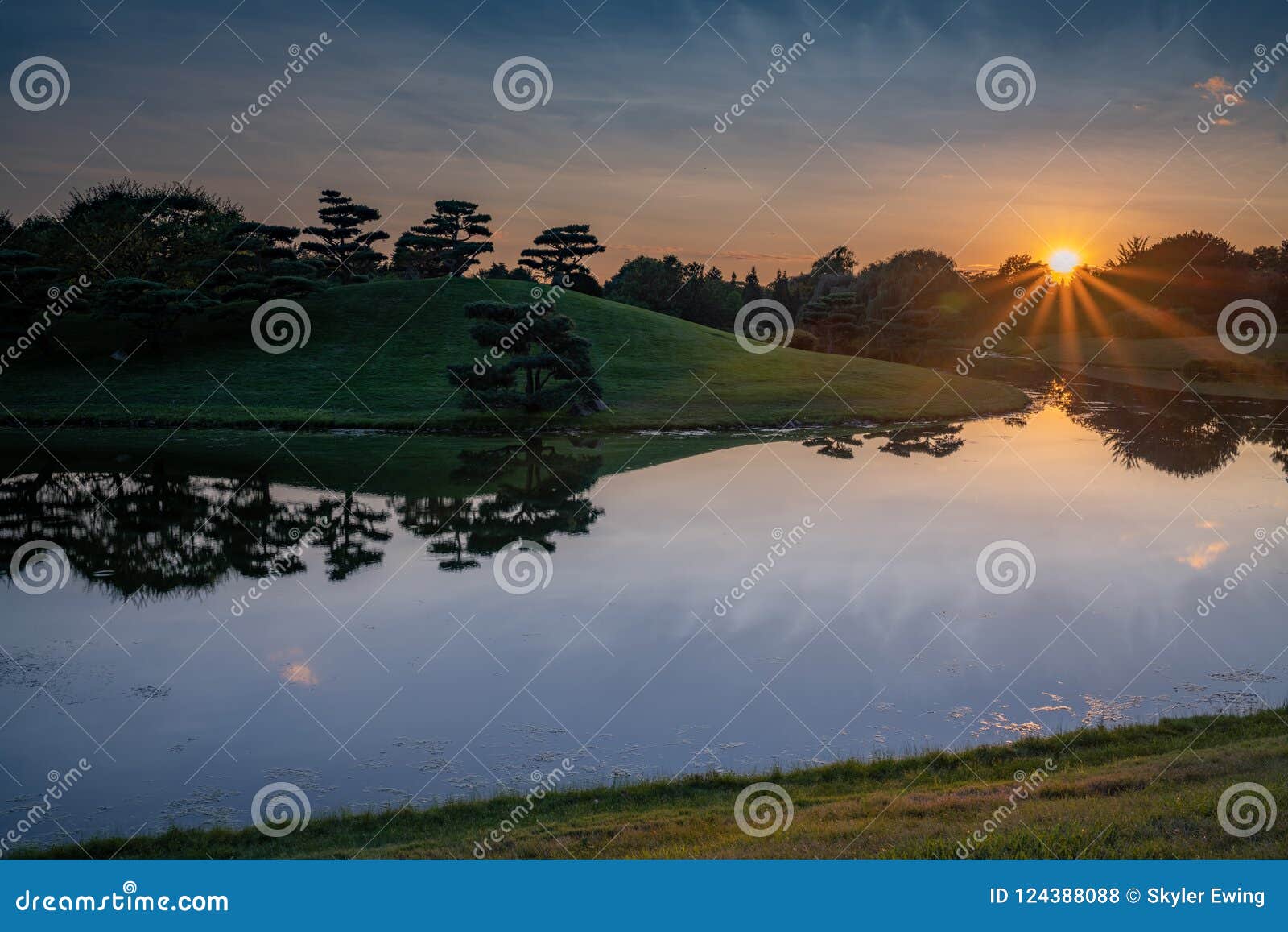 Reflection at the Lake at Sunset Stock Photo - Image of sunset, clowds ...