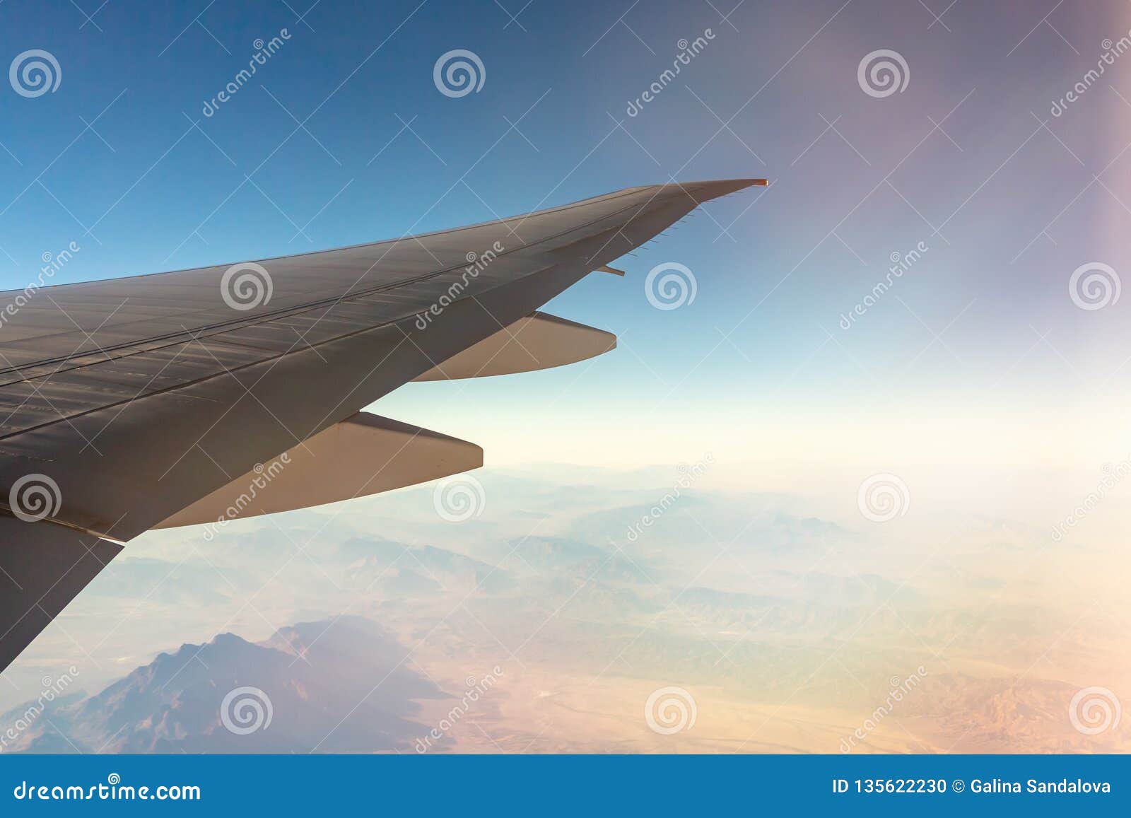 Clouds Under the Wing of an Airplane. Amazing View from the Window of ...