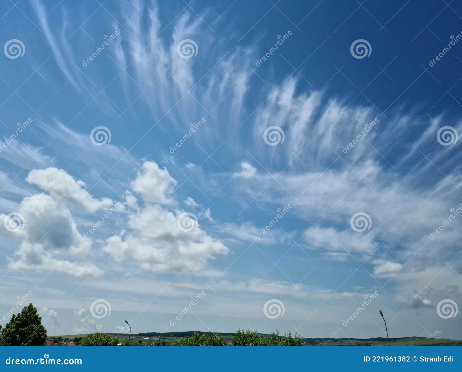 Clouds on a very blue sky stock photo. Image of gorgeous - 221961382