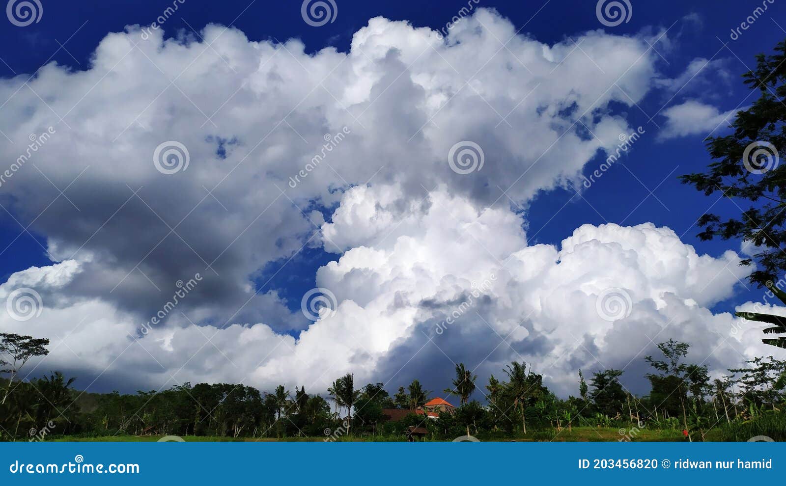 Cloudy on a bright sky stock photo. Image of sunlight - 203456820