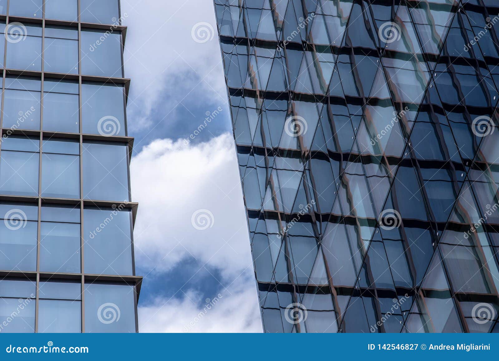 Cloudy Corner of the Sky between Skyscrapers with Reflective Windows ...