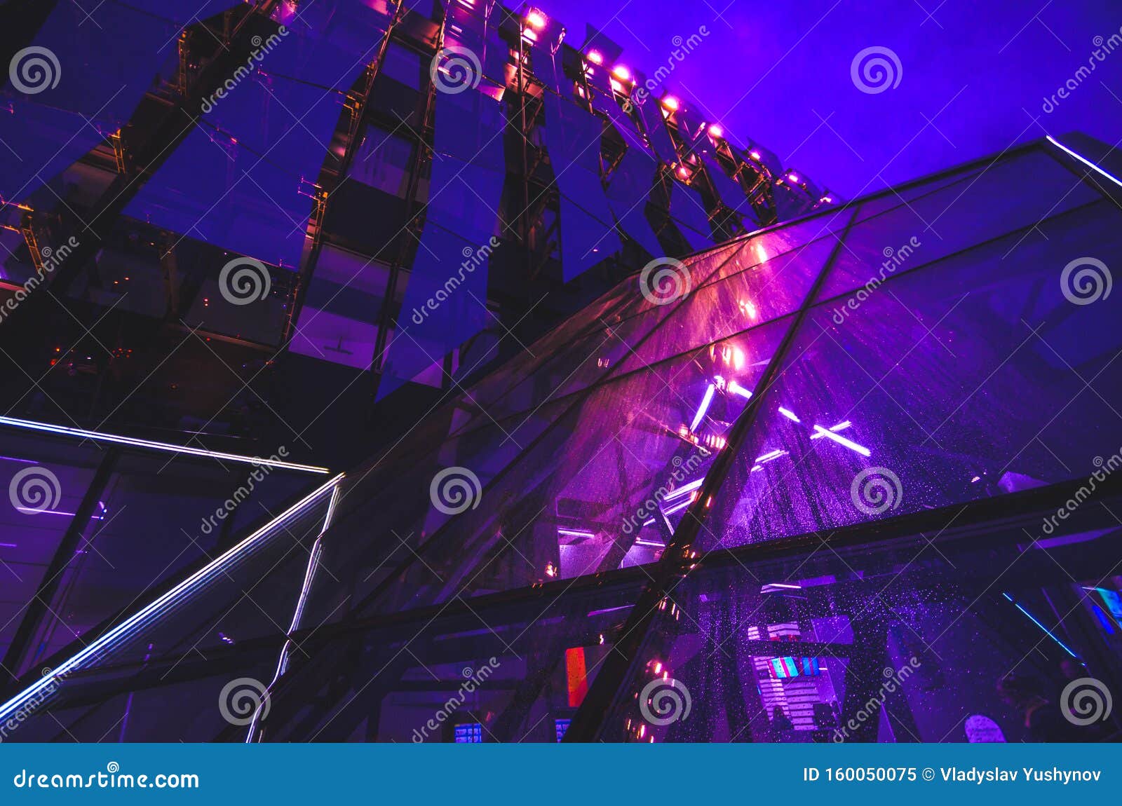 Synthwave Colors on a Glass Wall of a House with Raindrops Stock Image ...