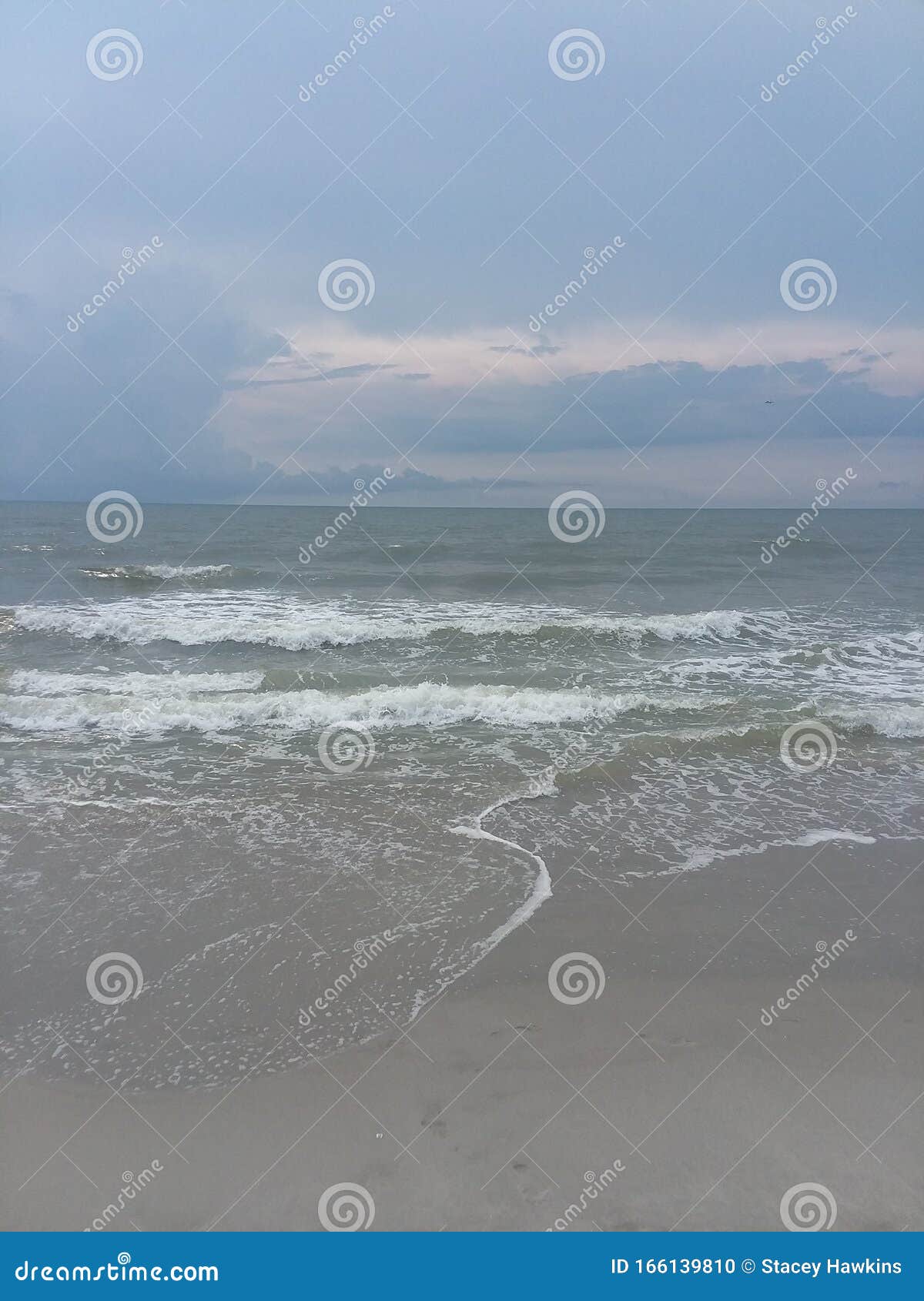 Cloudy Day at the Beach stock photo. Image of cloudy - 166139810