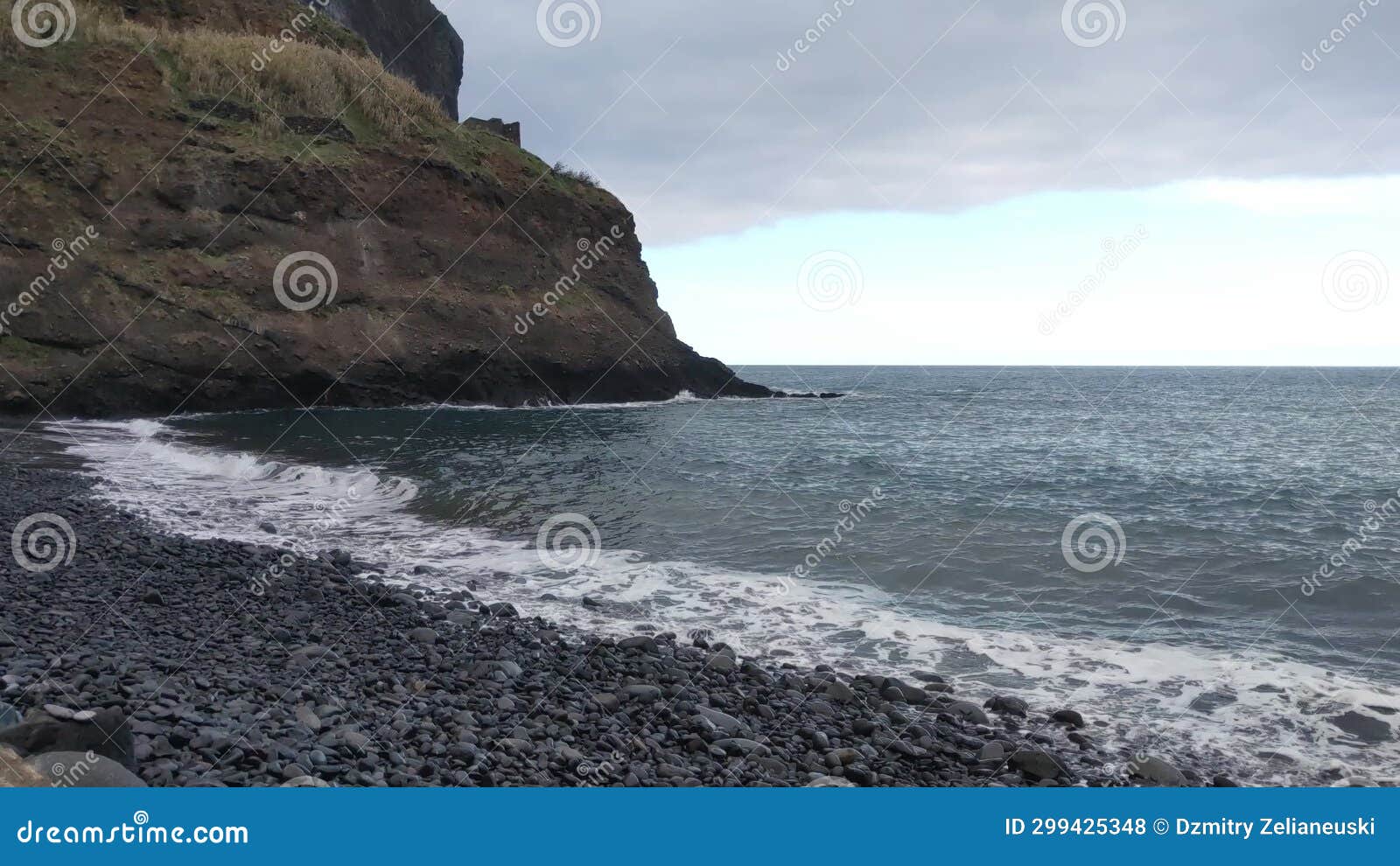 On a Cloudy Day, the Waves Roll Onto the Shore and the Beach. Stock ...
