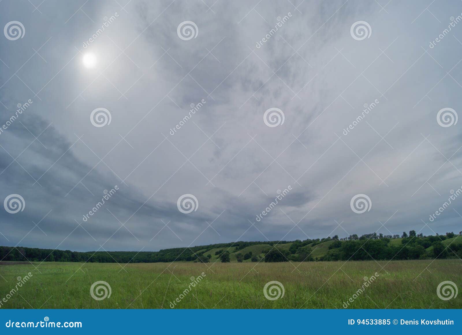 Cloudy Landscape. the Sun through the Clouds Over the Fields and Hills ...