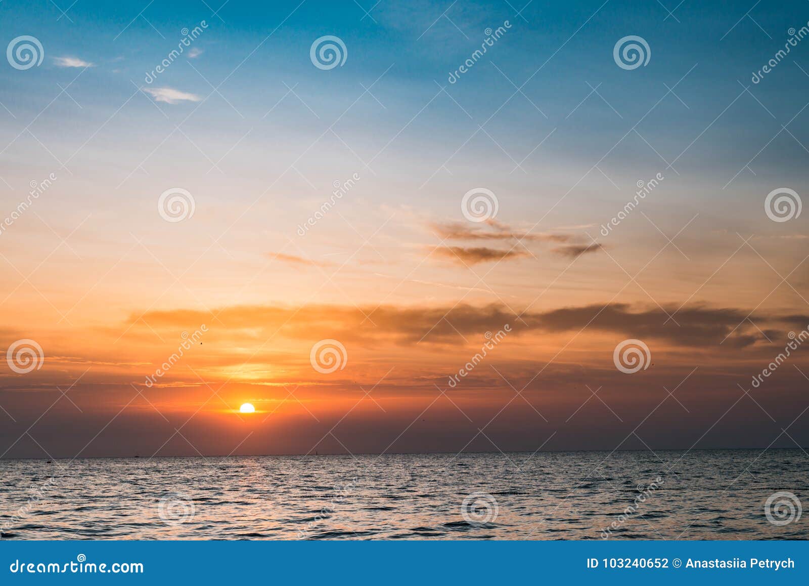 Cloudy Layered Sunset on the Ocean Stock Photo - Image of peaceful ...