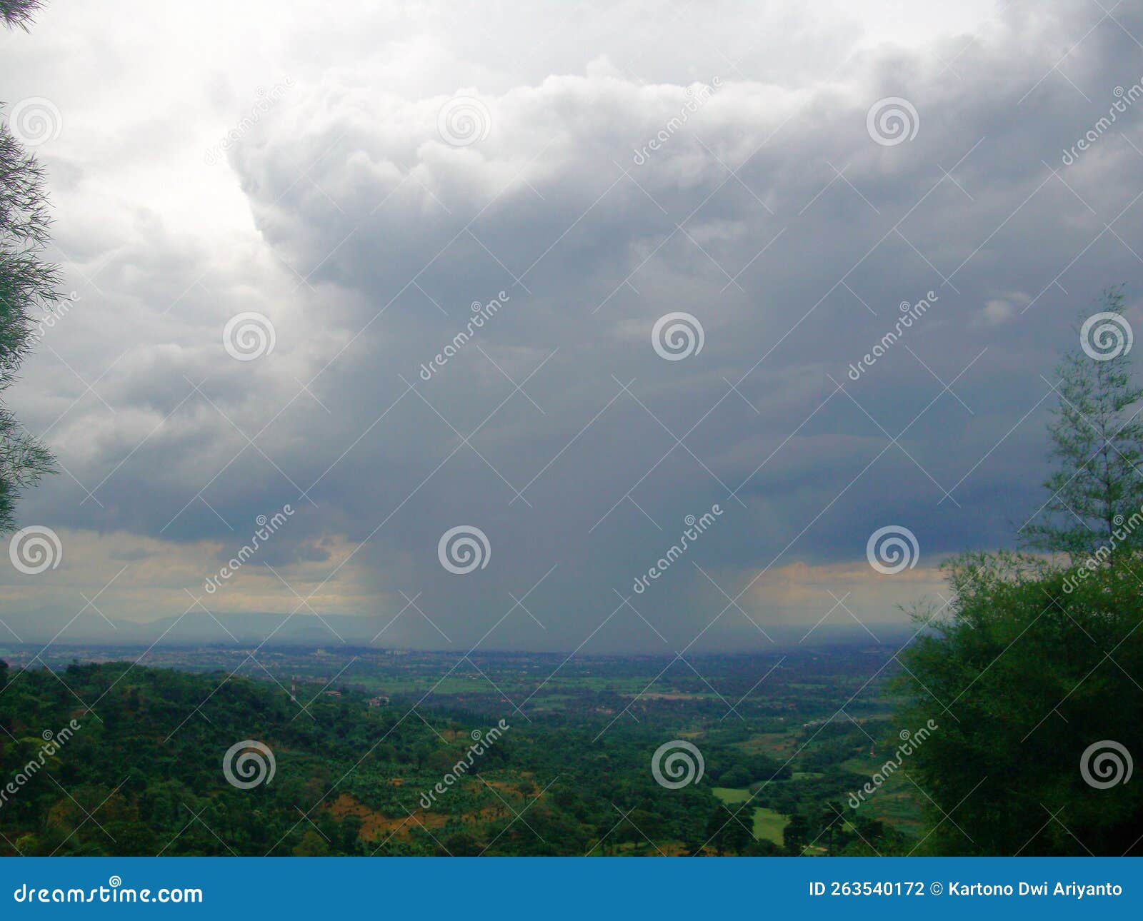 A Cloudy Raining in a Far View Stock Photo - Image of grassland, hill ...