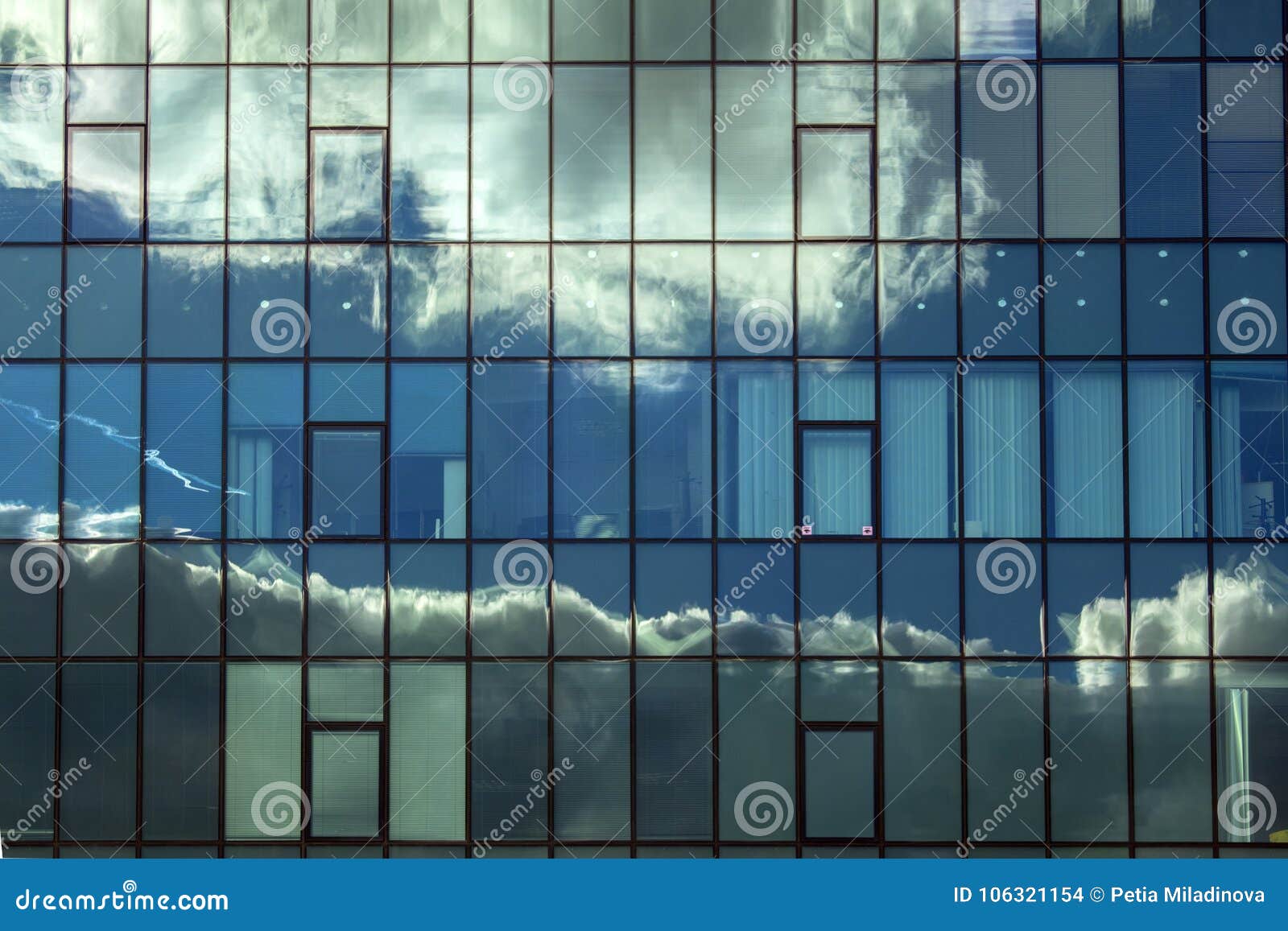 Cloudy Reflections in the Windows of the Building. Stock Photo - Image ...
