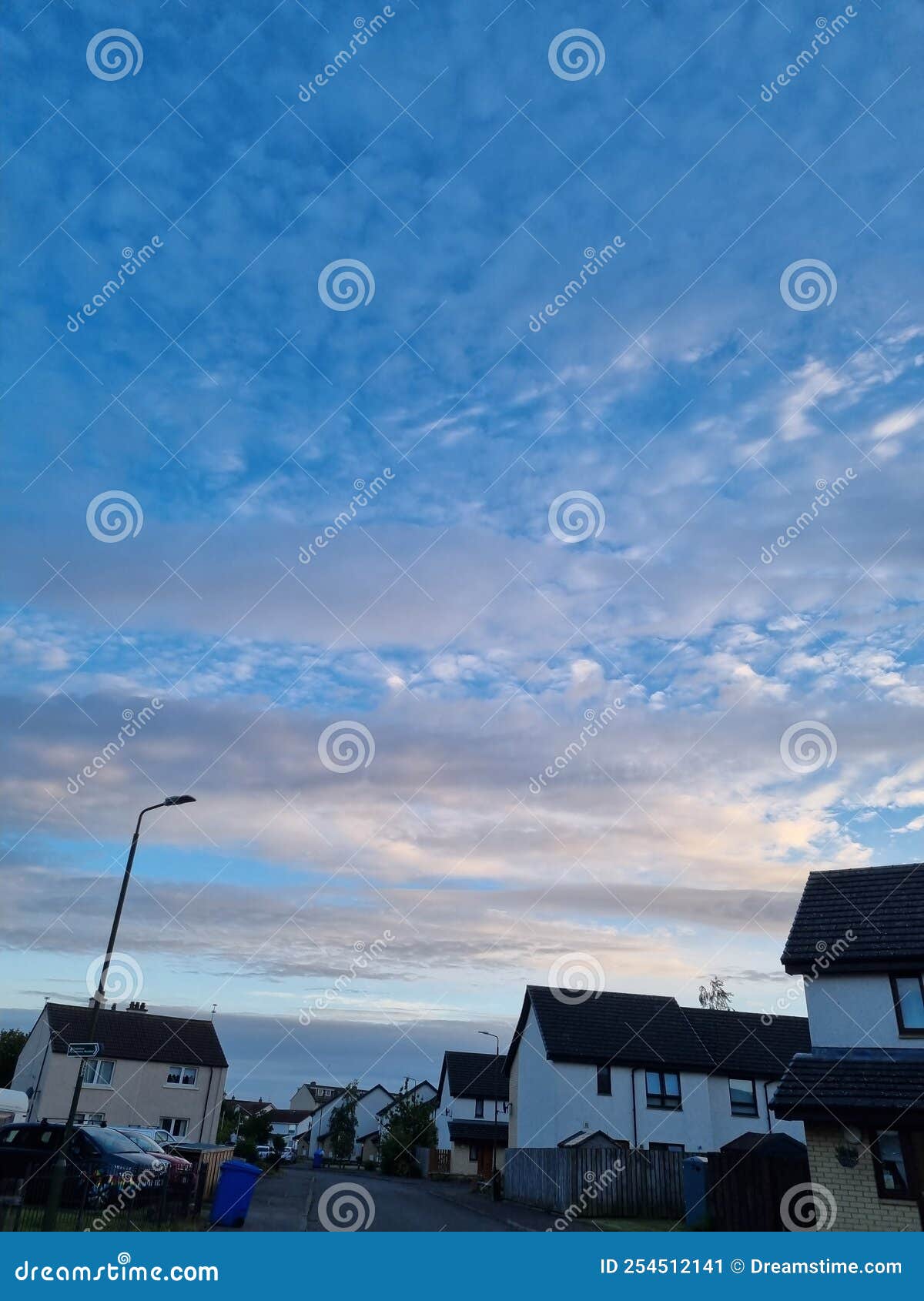 Cloudy sky with houses stock image. Image of tower, blue - 254512141