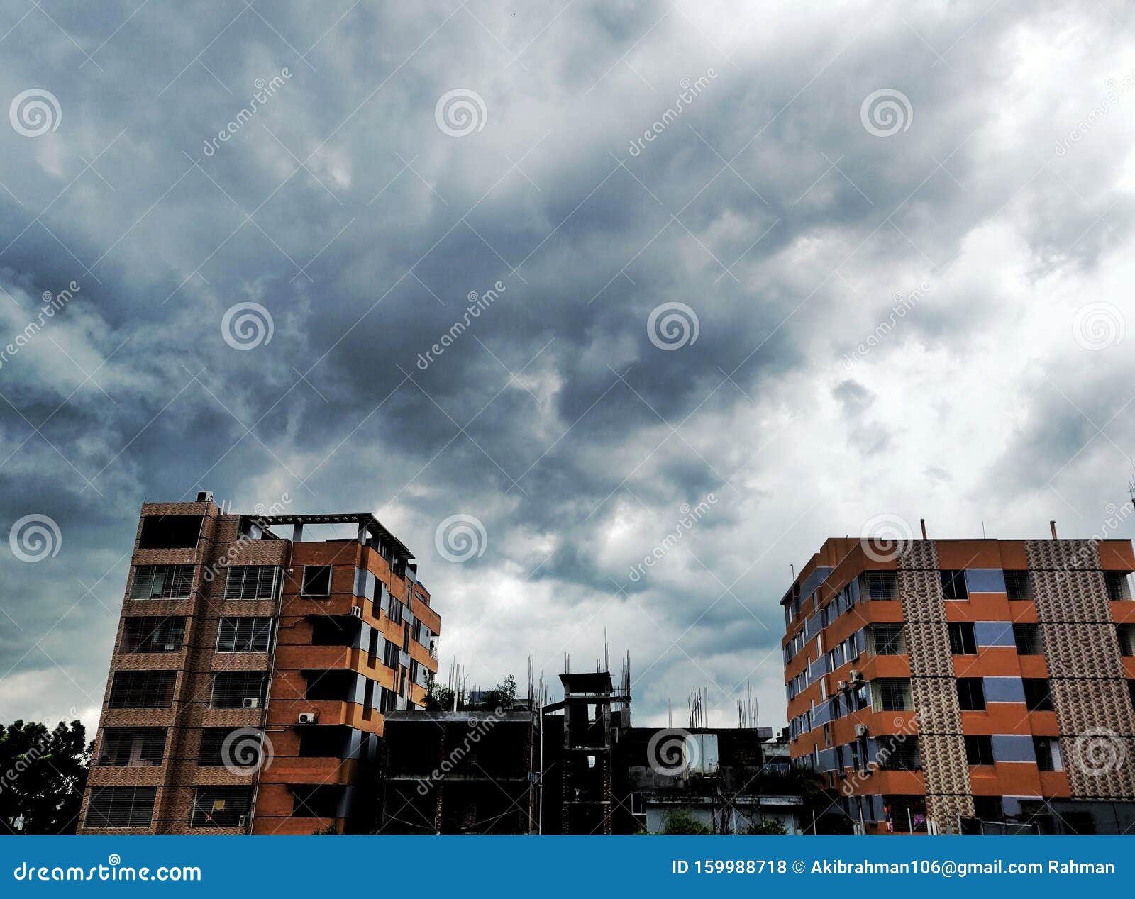 Cloudy Sky Over the Two Separate Building Stock Photo - Image of ...