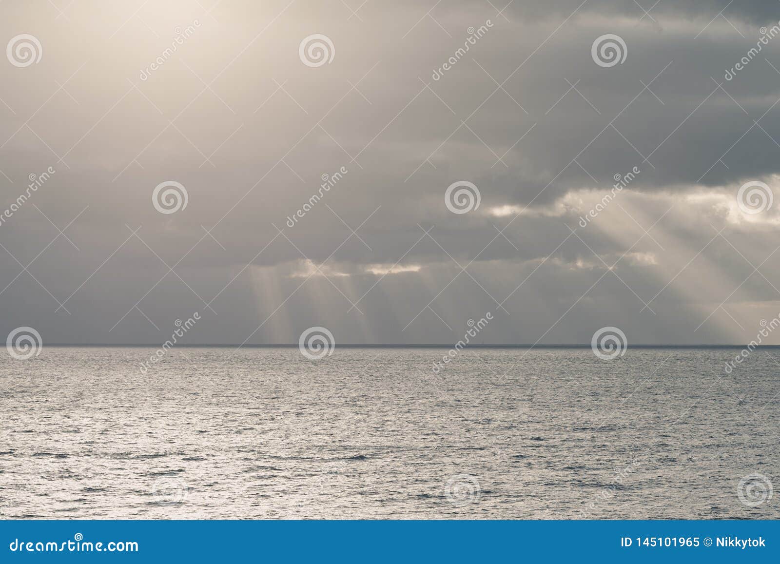 Cloudy Sky with Sun Rays in the Open Sea Stock Image - Image of rays ...