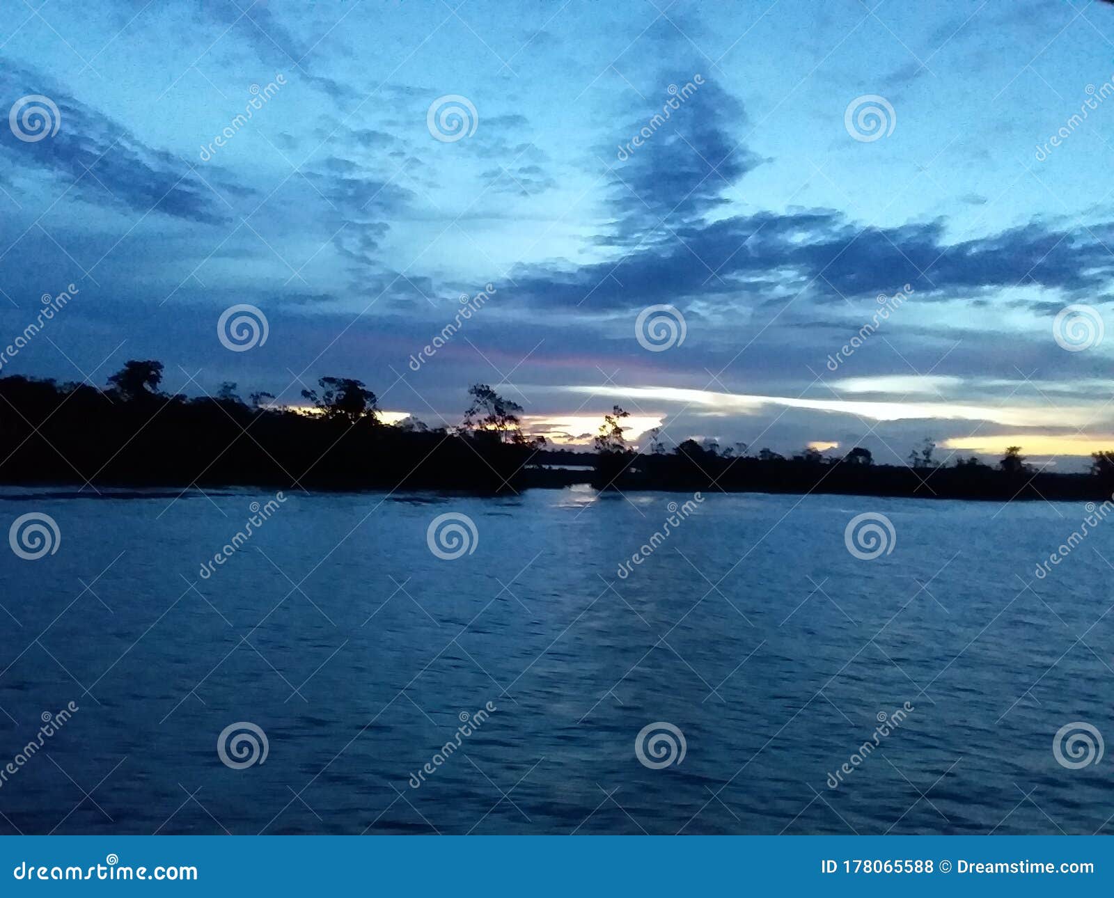 Cloudy Sunrise on the Amazon River Stock Photo - Image of sunrise ...